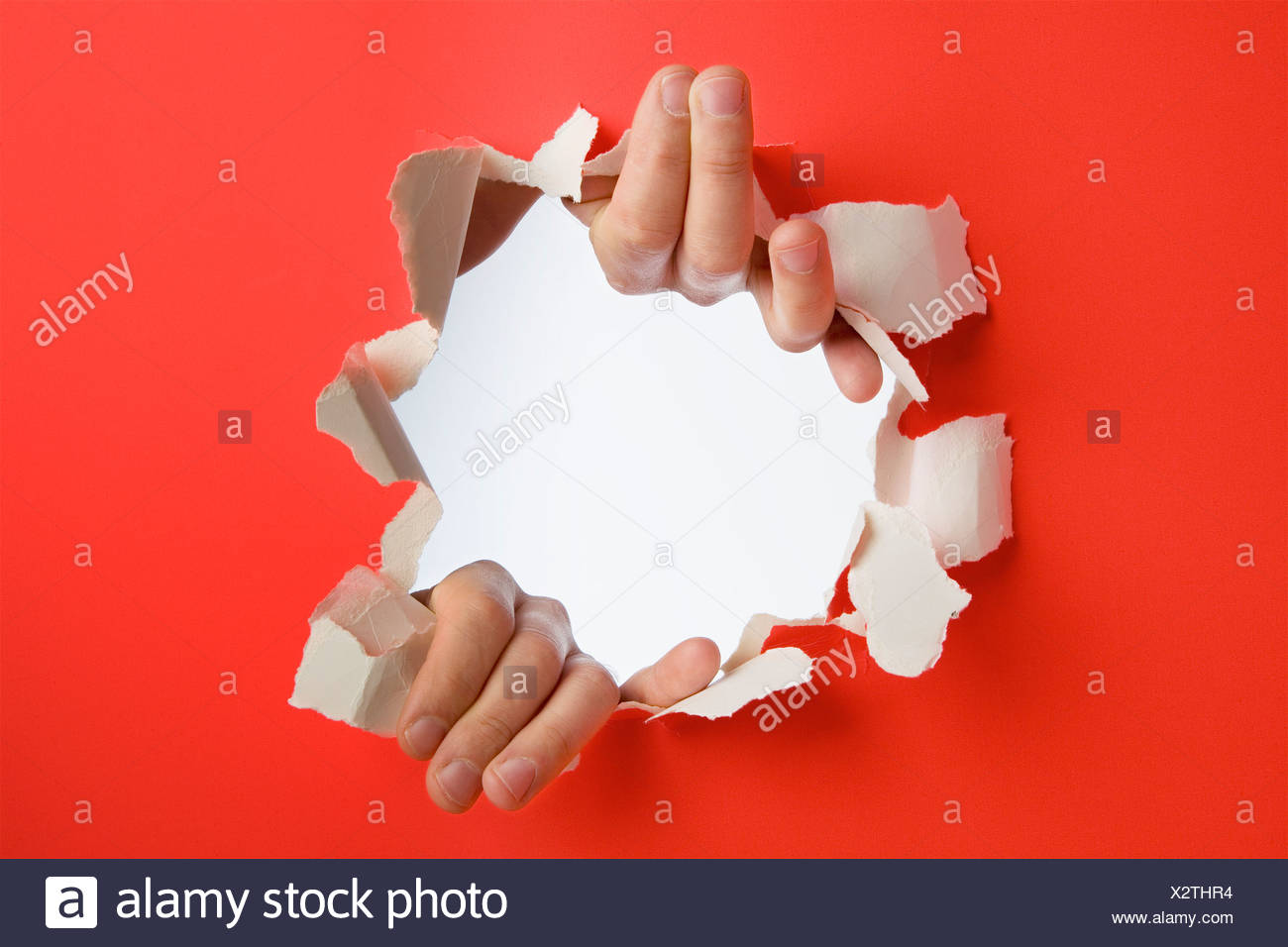 Hands Breaking Through Wall Stock Photos & Hands Breaking Through Wall ...