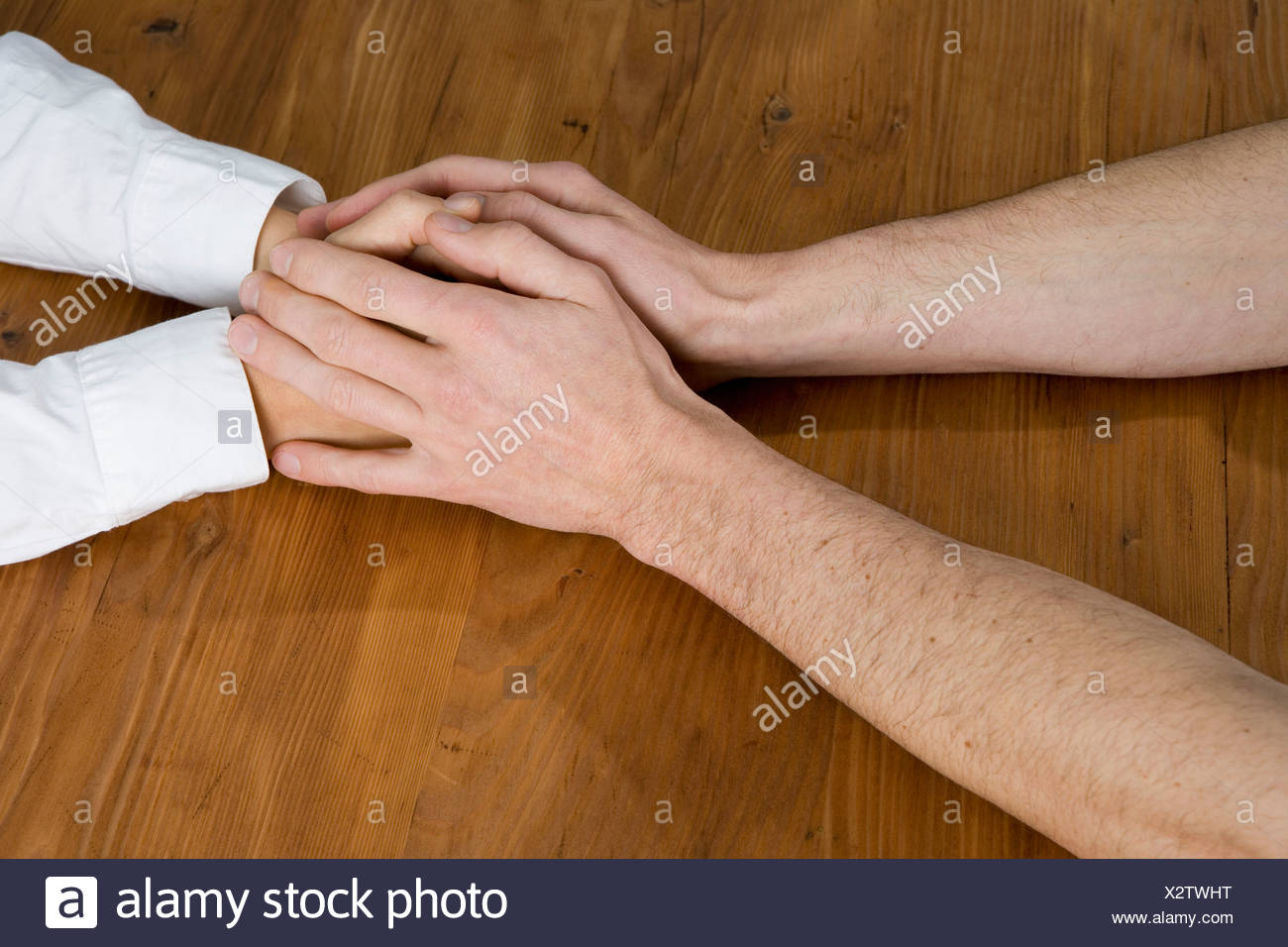 Holding Hands Across Table High Resolution Stock Photography and Images ...