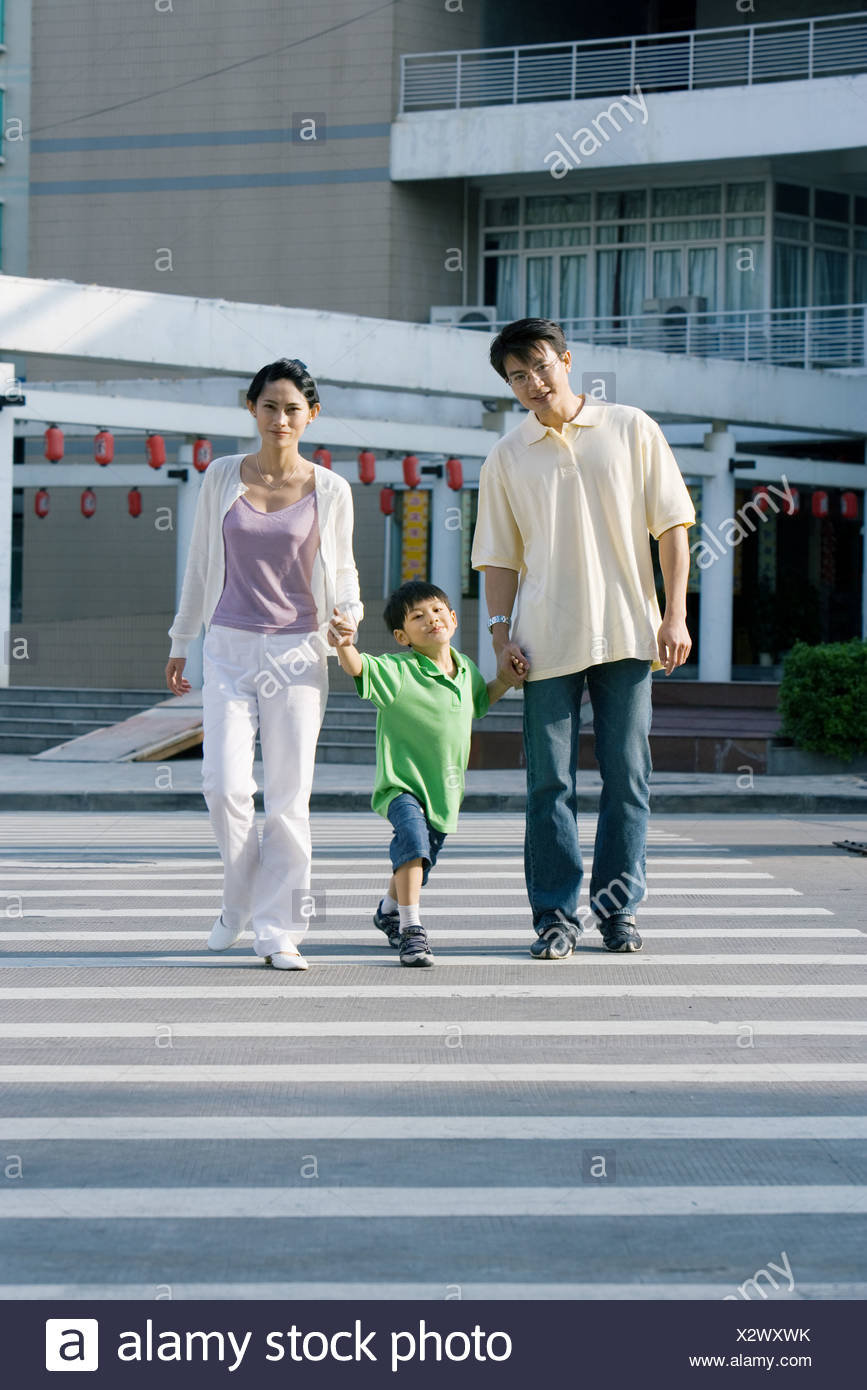 Family Crossing Crosswalk Holding Hands High Resolution Stock ...