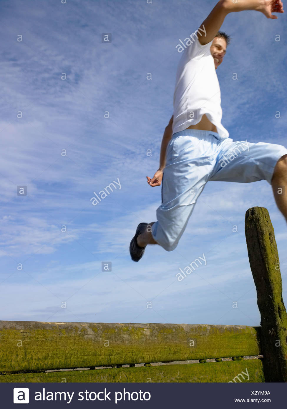 Adult Jumping Over Fence Stock Photos & Adult Jumping Over Fence Stock ...