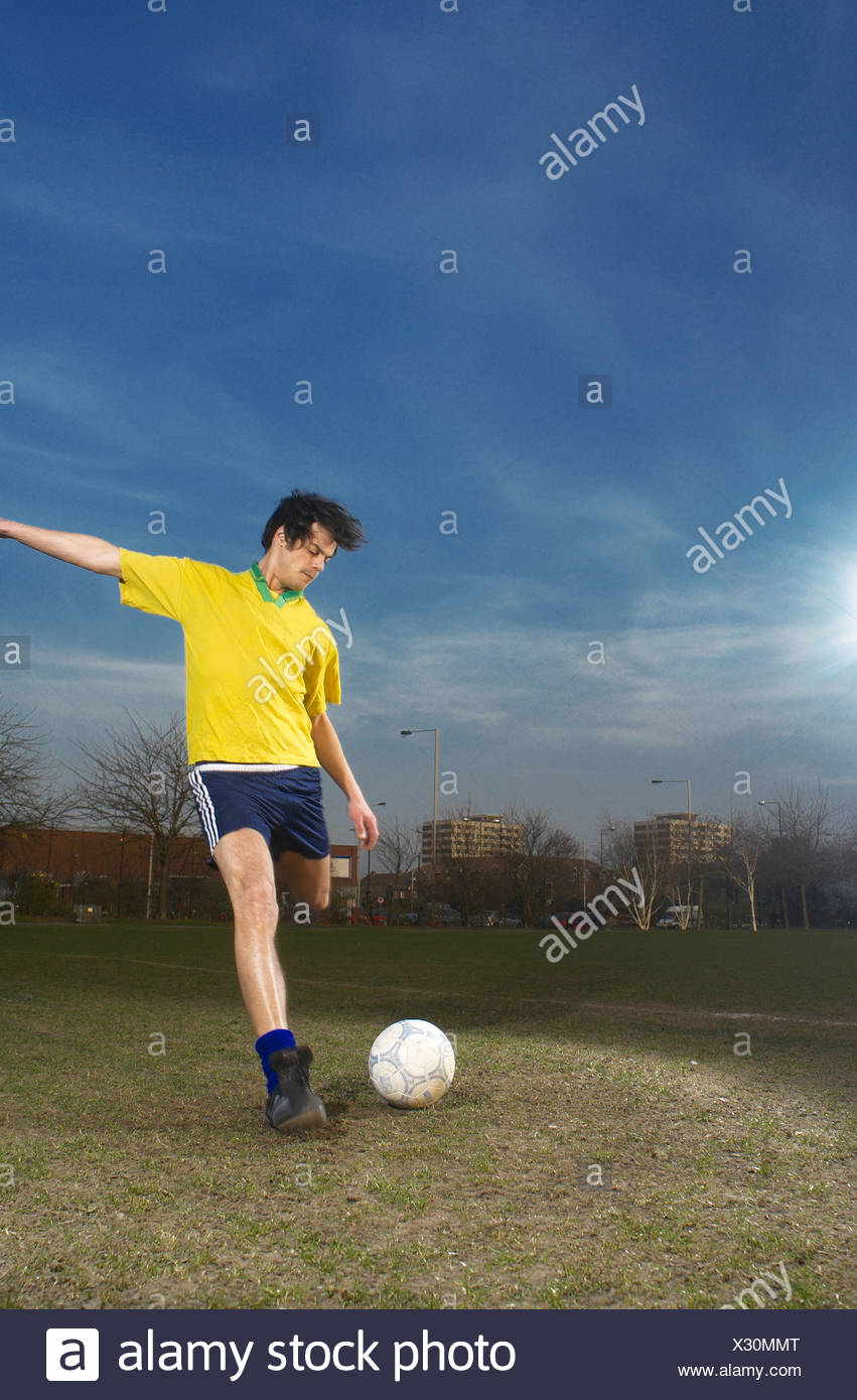 Footballer Kicking Ball Stock Photos & Footballer Kicking Ball Stock ...