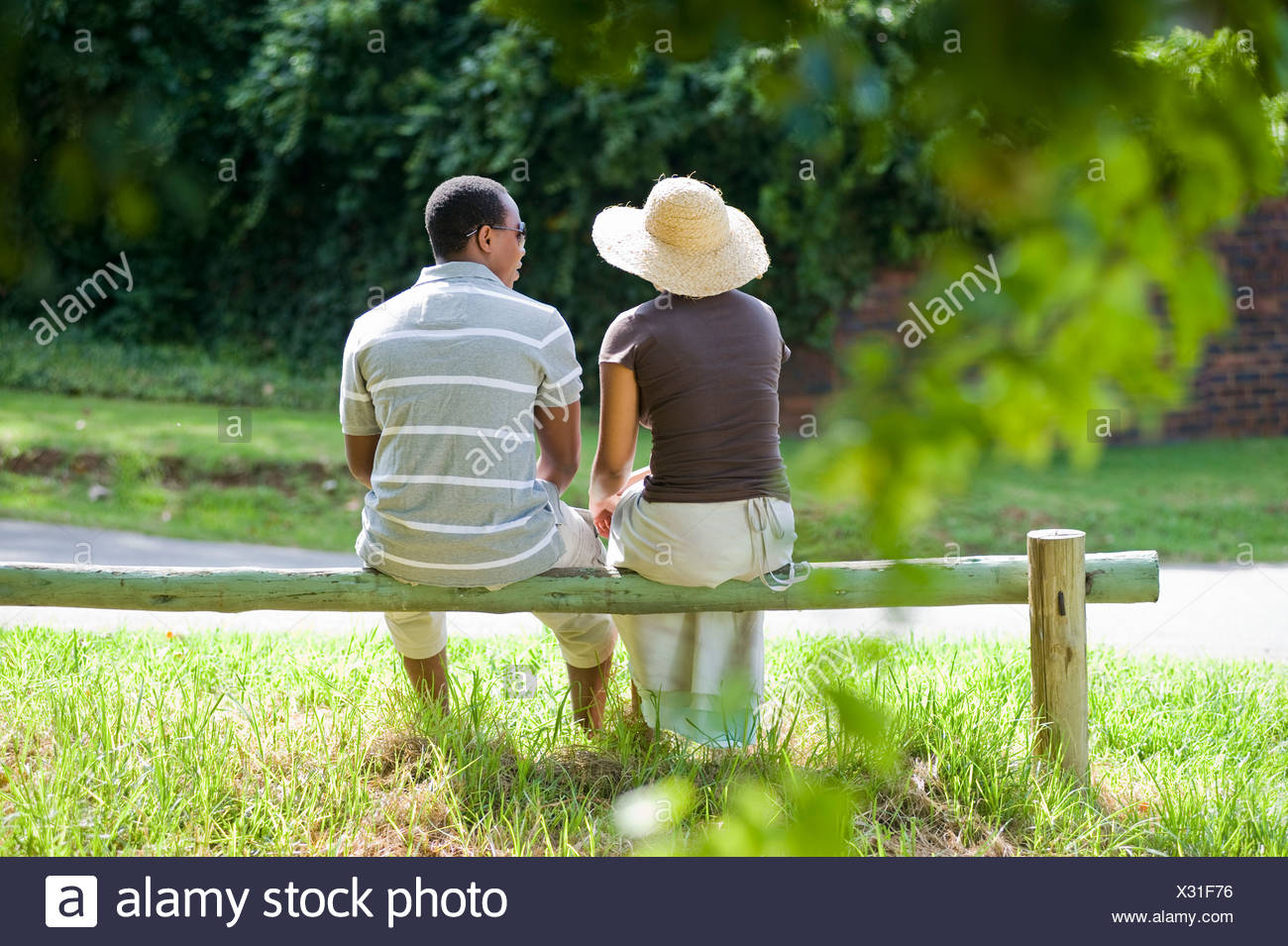 Men Sitting On A Fence Stock Photos & Men Sitting On A Fence Stock ...
