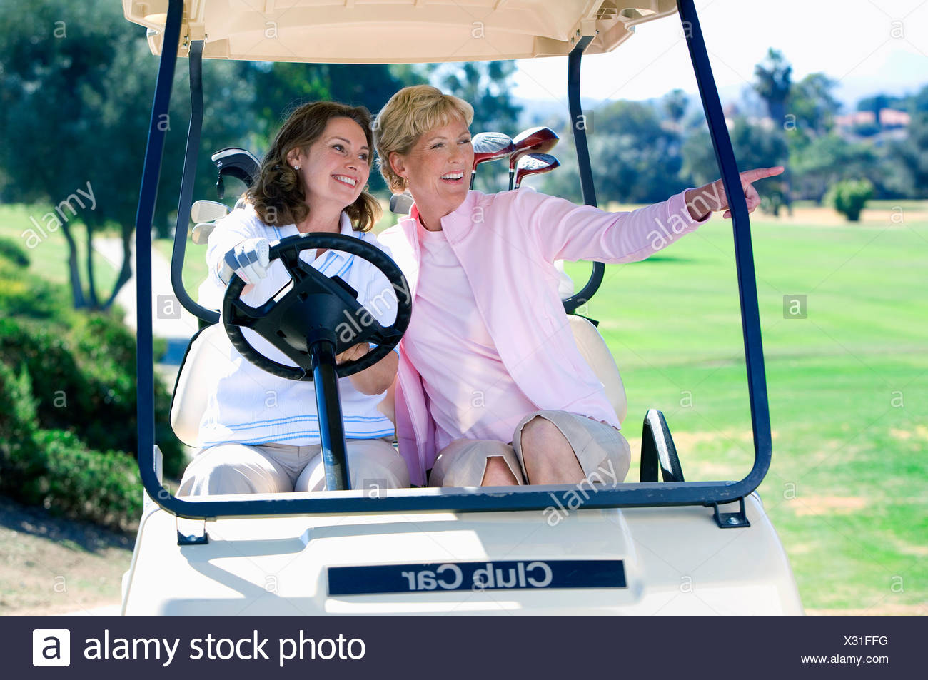 Woman Sitting In Golf Cart Stock Photos & Woman Sitting In Golf Cart ...