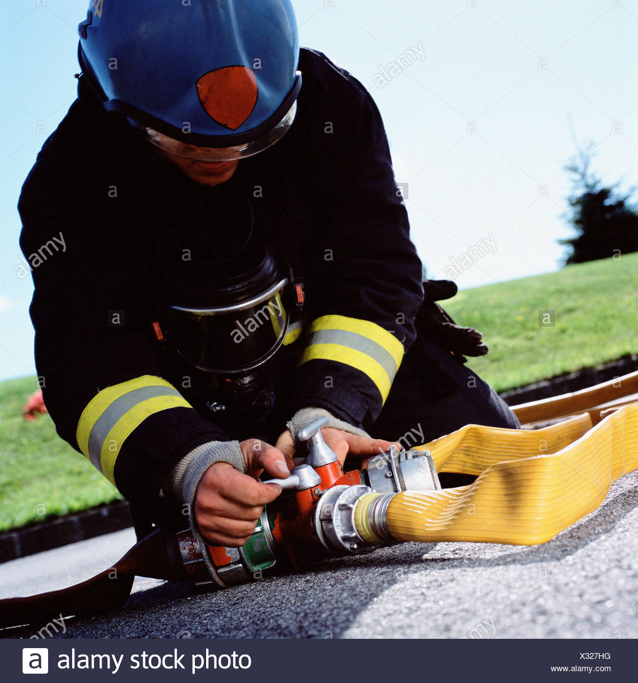 Fireman Hose Person Stock Photos & Fireman Hose Person Stock Images - Alamy