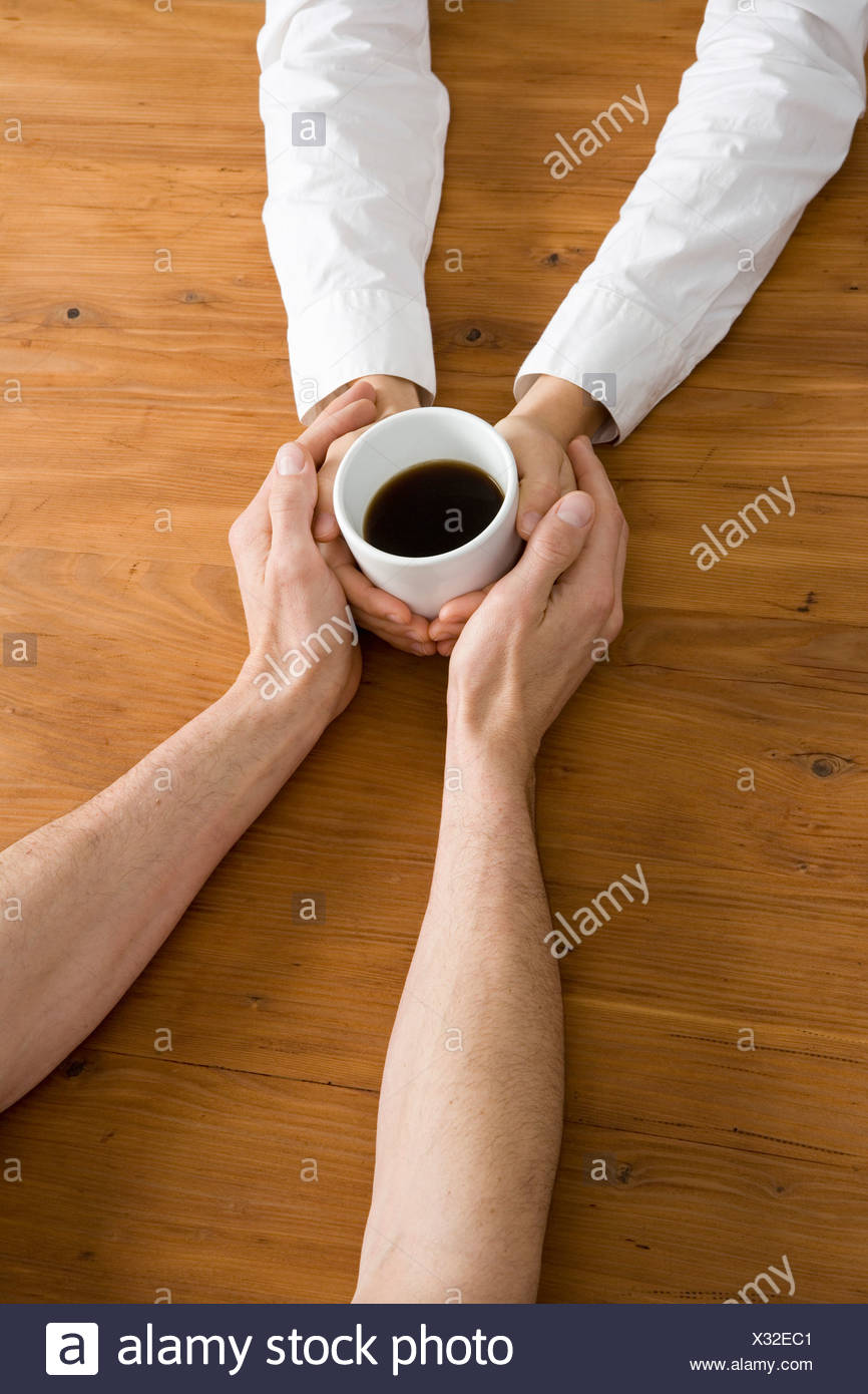 Reaching Across Table High Resolution Stock Photography and Images - Alamy