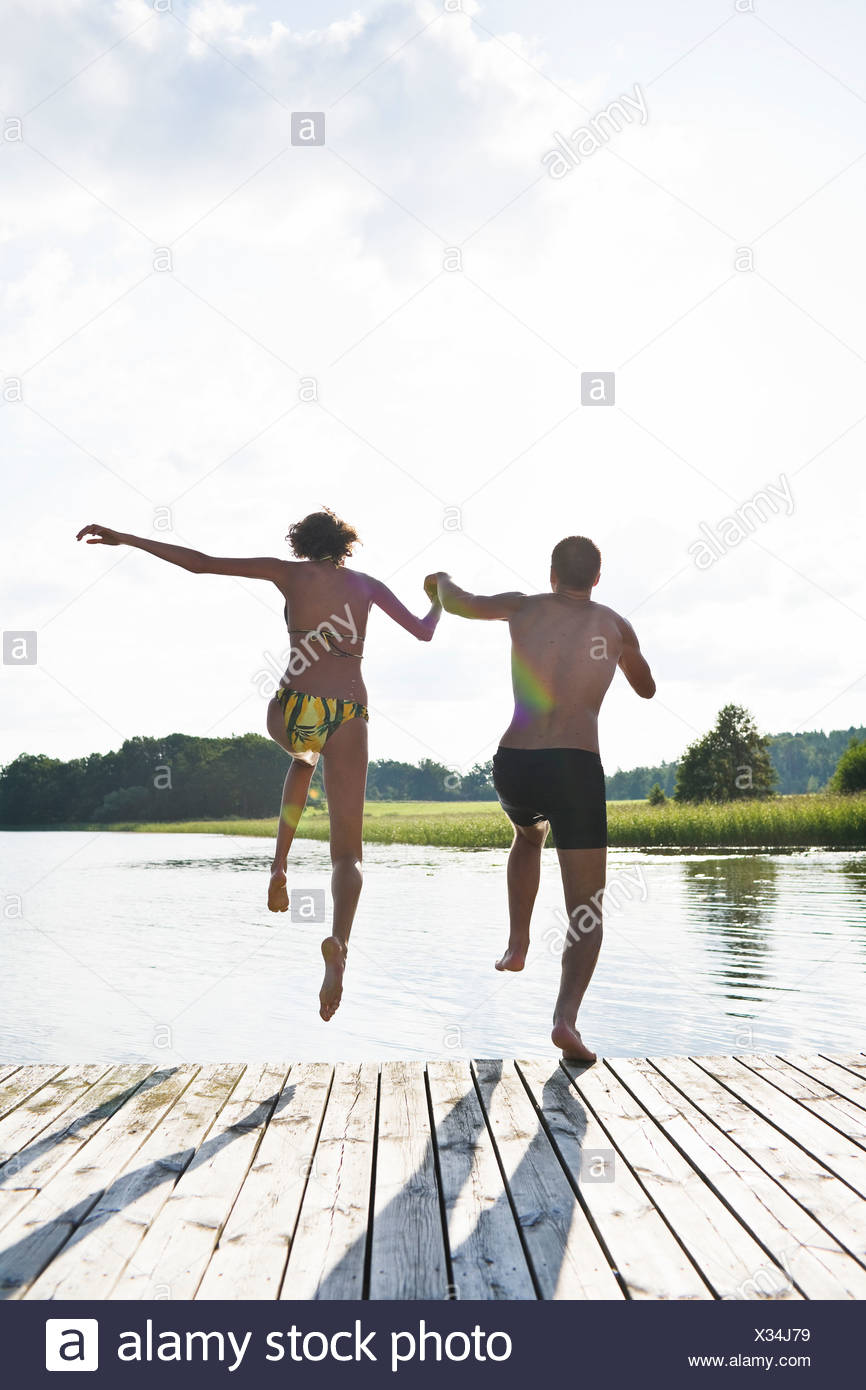 Couple Jumping Lake High Resolution Stock Photography and Images - Alamy
