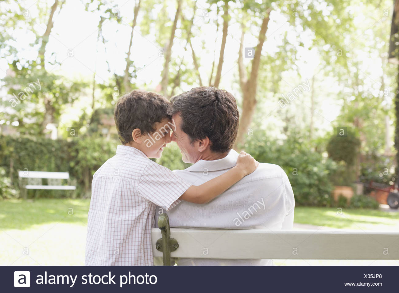 Boy Sitting On Wooden Bench Stock Photos & Boy Sitting On Wooden Bench ...
