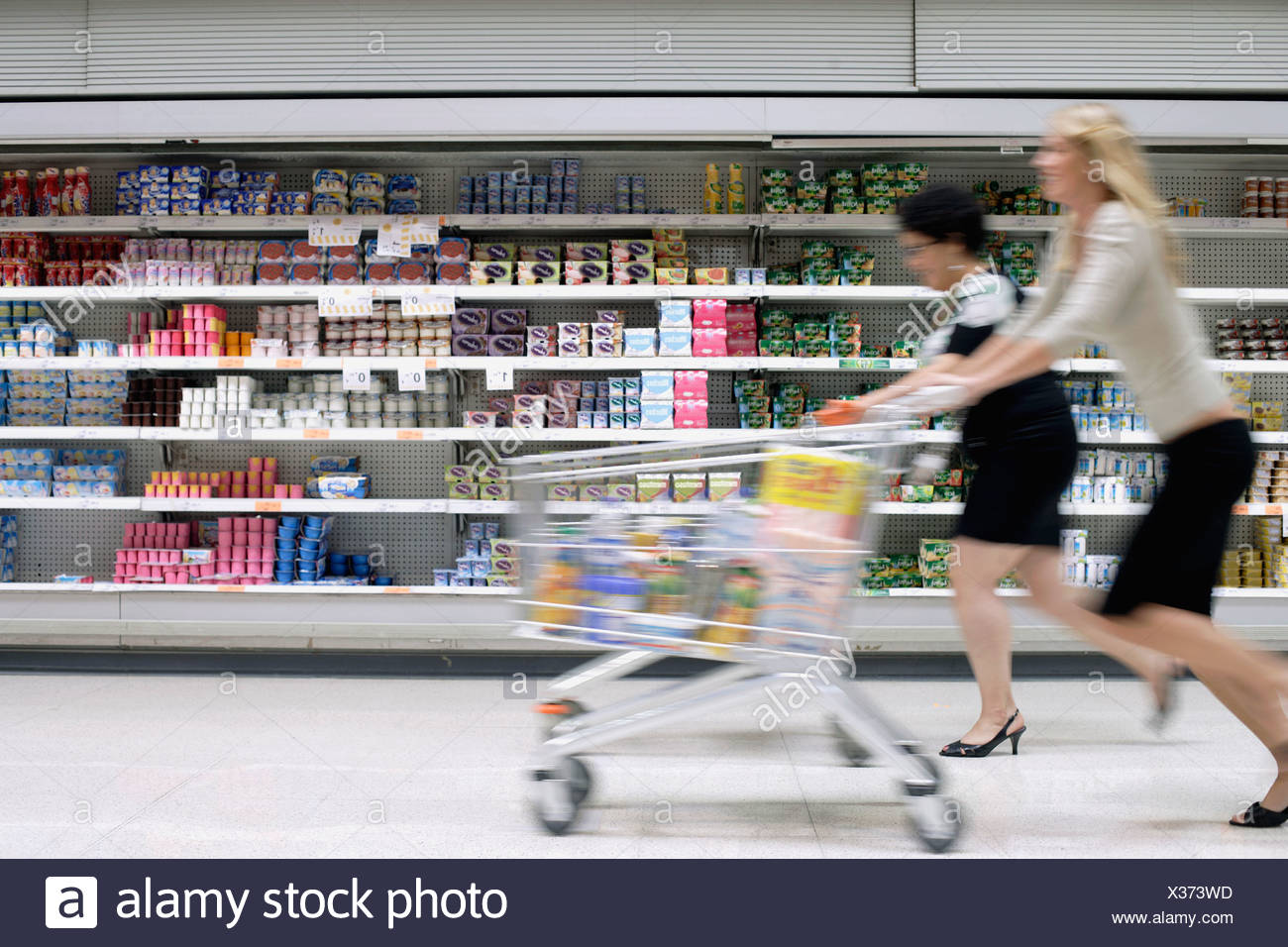 Girl Running Shopping Cart Stock Photos & Girl Running Shopping Cart ...
