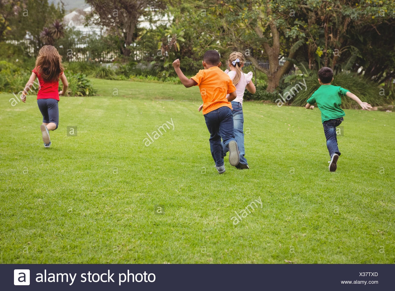 Boy Running Across Grass Stock Photos & Boy Running Across Grass Stock ...