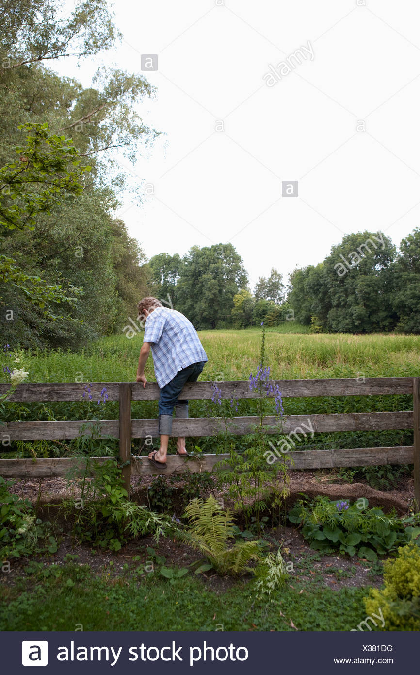 Climbing Over Fence High Resolution Stock Photography and Images - Alamy