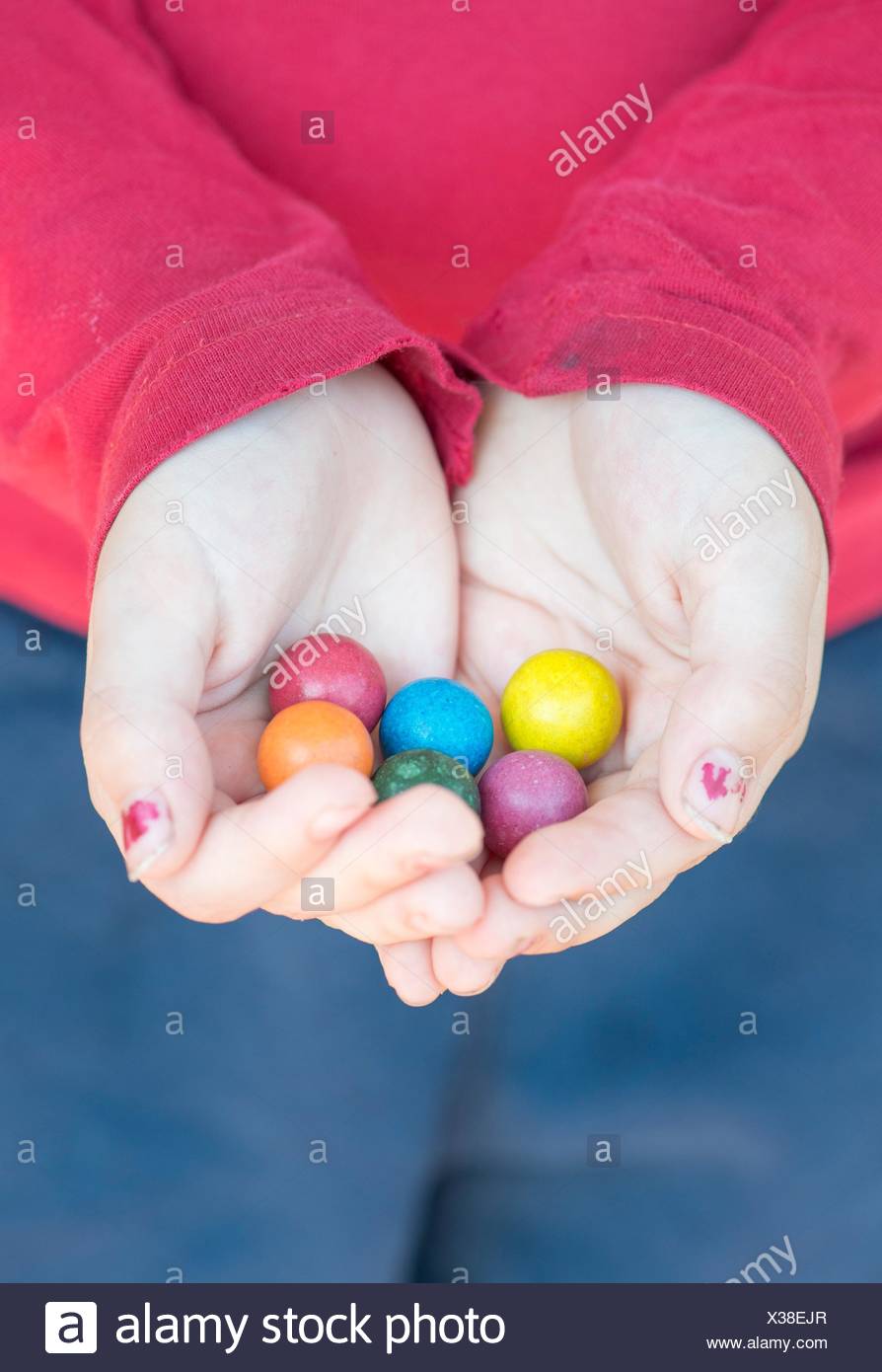 Hands Holding Marbles High Resolution Stock Photography and Images - Alamy