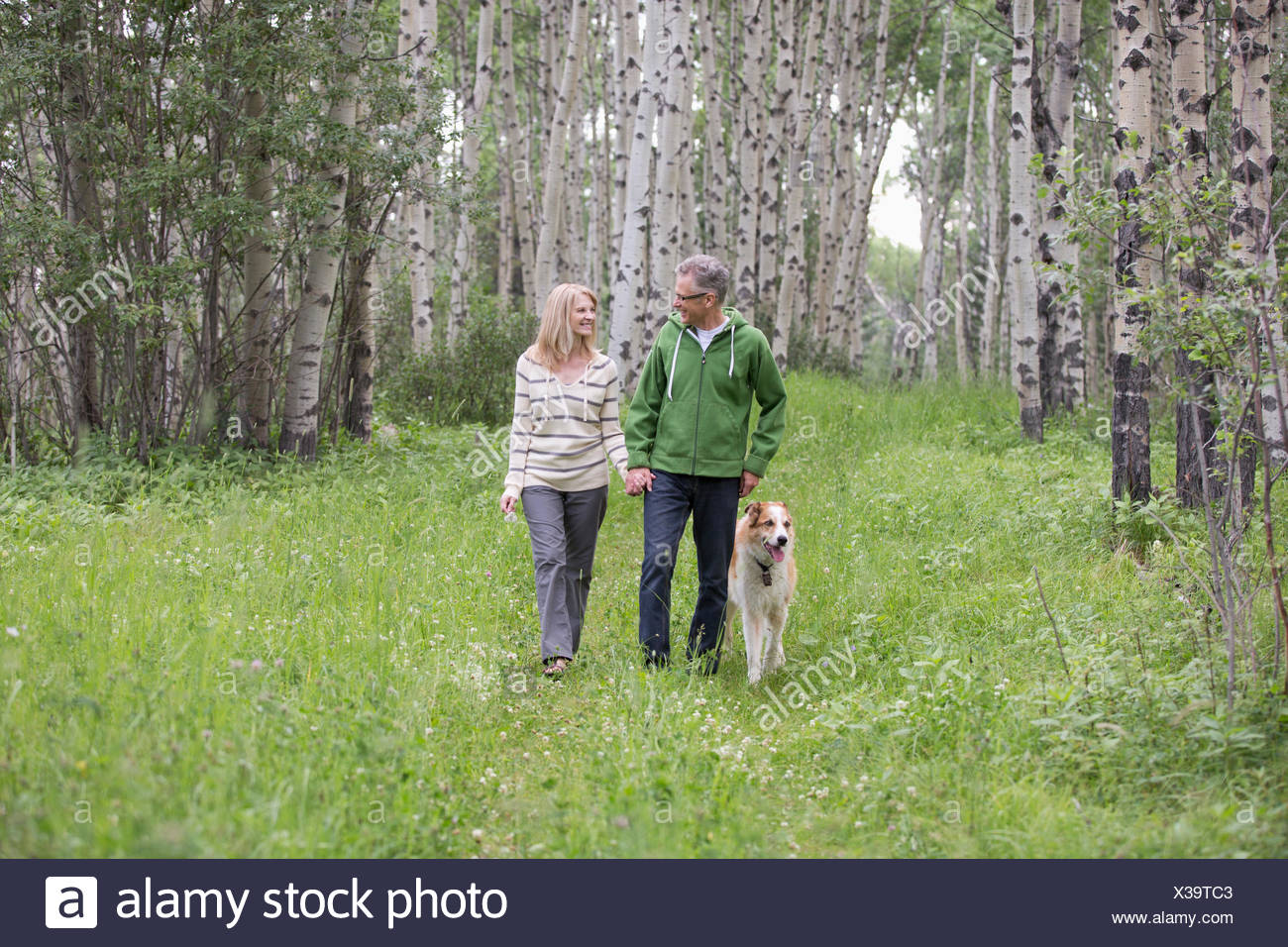 Woman Walking Dog In Woods Stock Photos & Woman Walking Dog In Woods ...