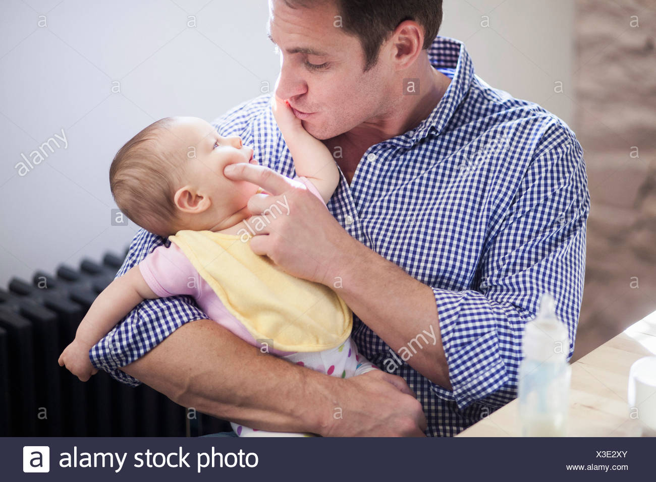 Man Cradling Baby High Resolution Stock Photography and Images - Alamy