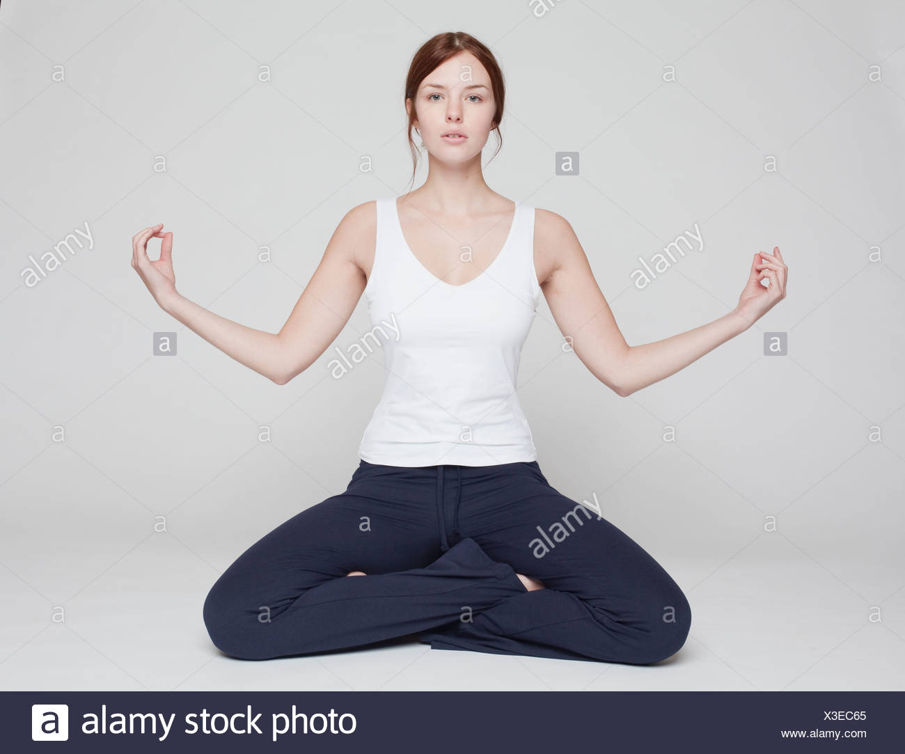 Girl Sitting In Lotus Position Stock Photos & Girl Sitting In Lotus ...