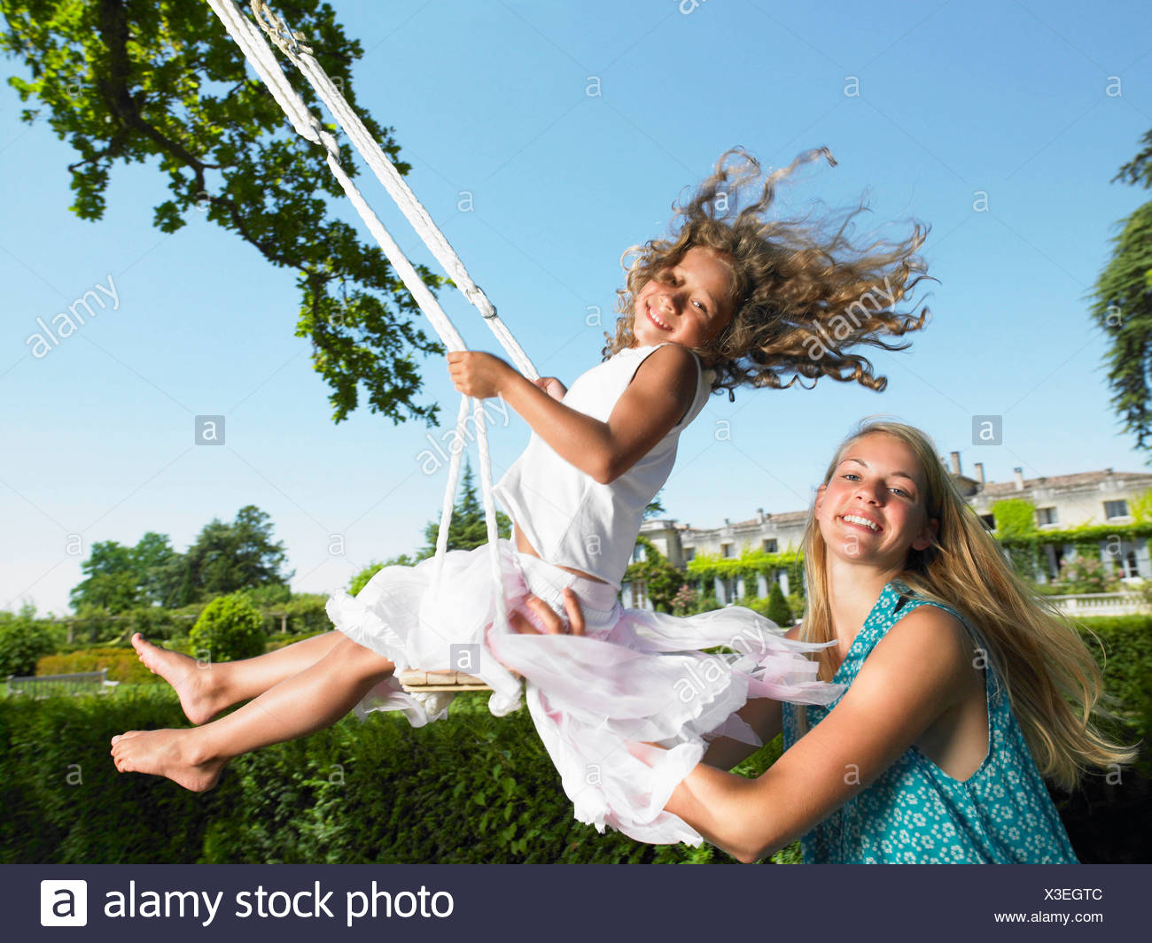 Child Pushed On Swing Stock Photos & Child Pushed On Swing Stock Images ...