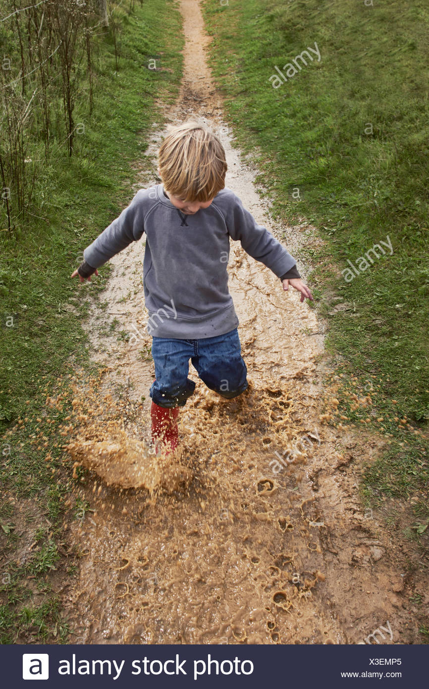 Boy Puddle Splashing High Resolution Stock Photography and Images - Alamy