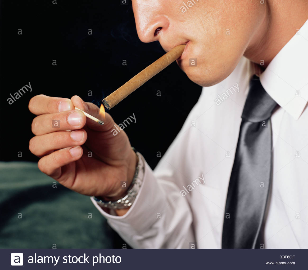 Man Lighting Cigar High Resolution Stock Photography and Images - Alamy
