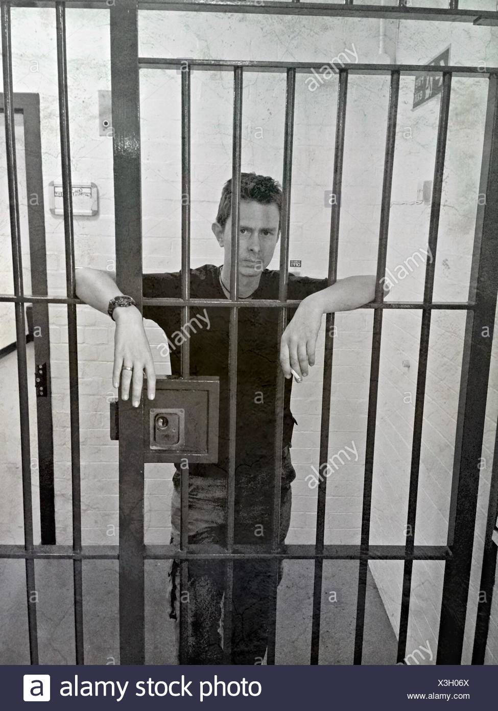 Prisoner Standing Behind Prison Cell High Resolution Stock Photography ...