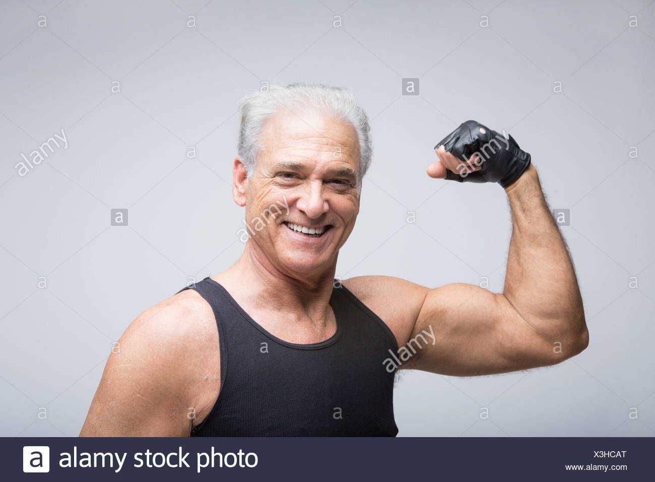 Old Man Flexing Muscles Stock Photos & Old Man Flexing Muscles Stock ...
