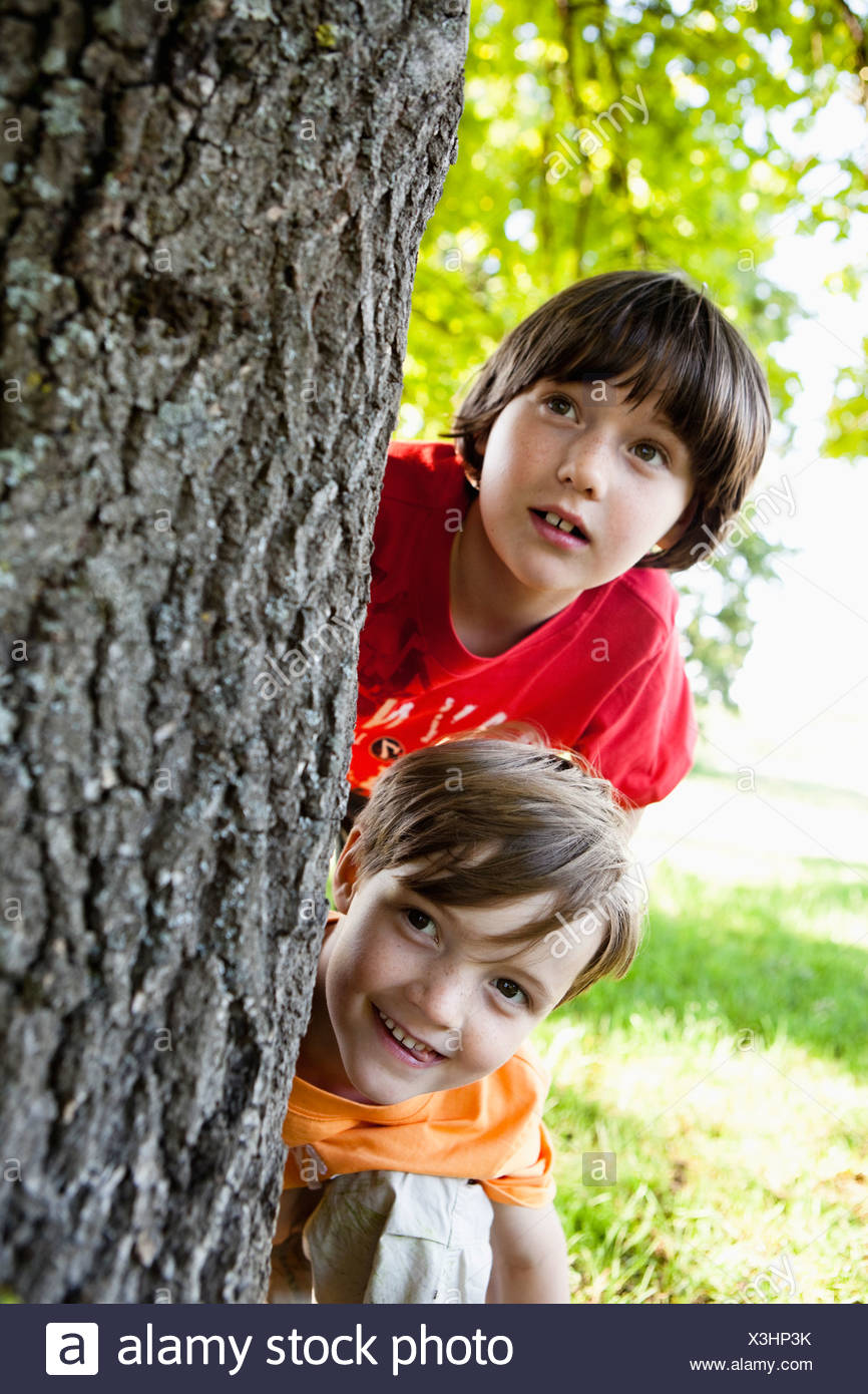 Boy Hiding Behind Tree High Resolution Stock Photography and Images - Alamy