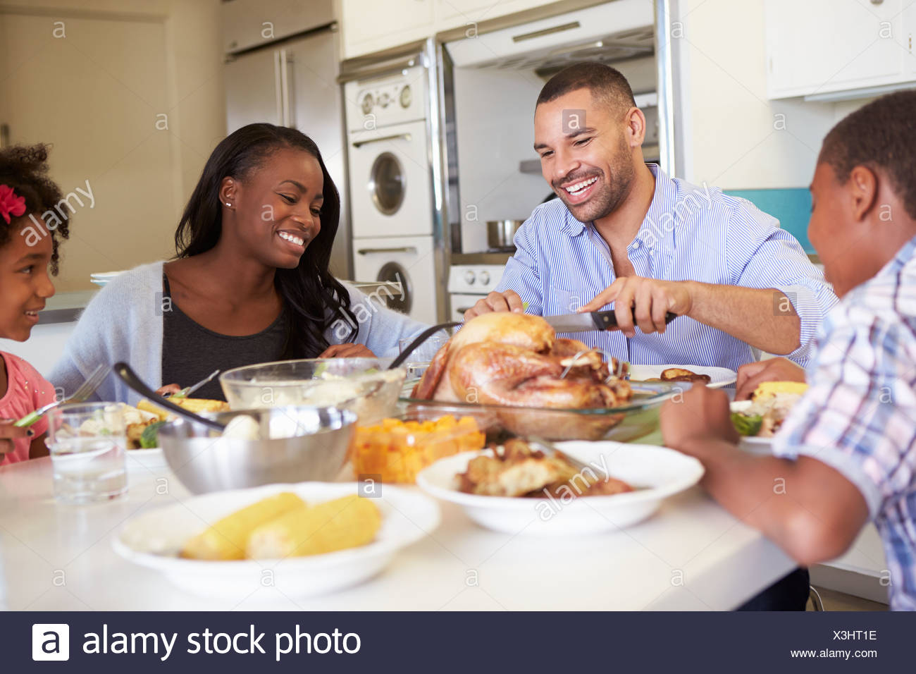 Family Eating Dinner Around Table High Resolution Stock Photography and ...
