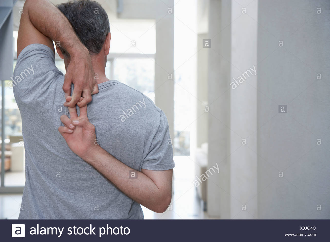 Arms Behind Back Back View Stock Photos & Arms Behind Back Back View ...