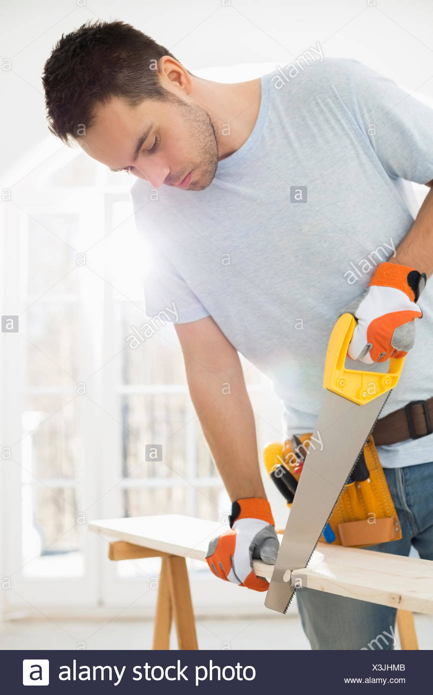 Man Sawing Wood High Resolution Stock Photography and Images - Alamy