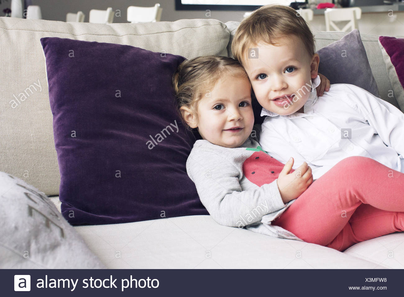 Sister Brother Sitting On Couch High Resolution Stock Photography and ...