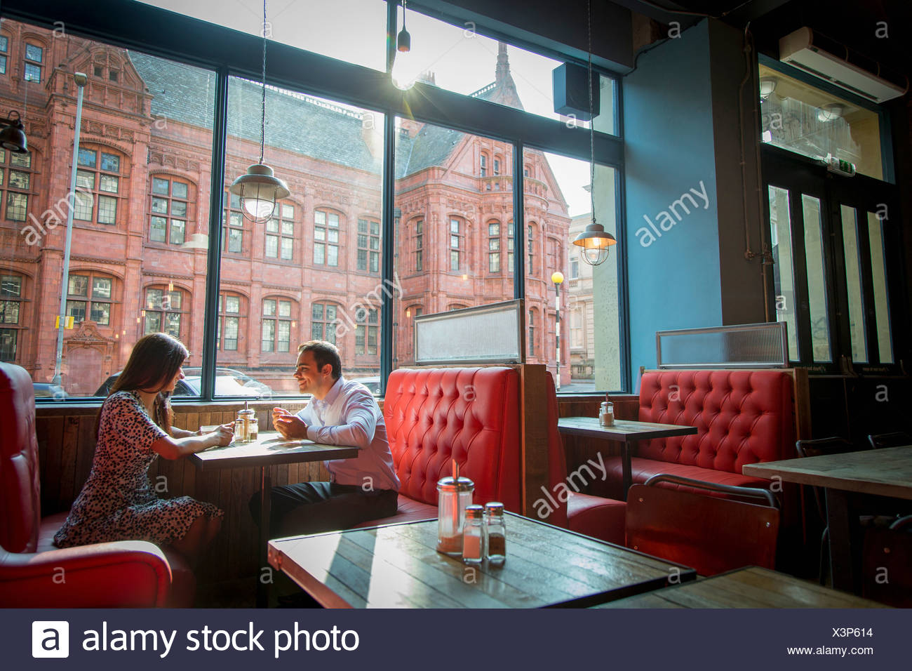 Woman Sitting In Restaurant Booth Stock Photos & Woman Sitting In ...