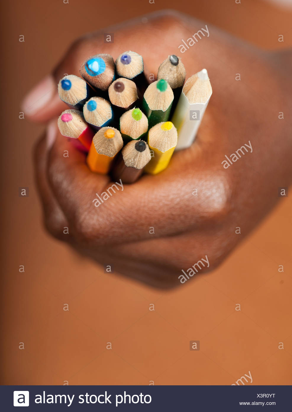 Childs Hand Gripping Colored Pencils High Resolution Stock Photography ...
