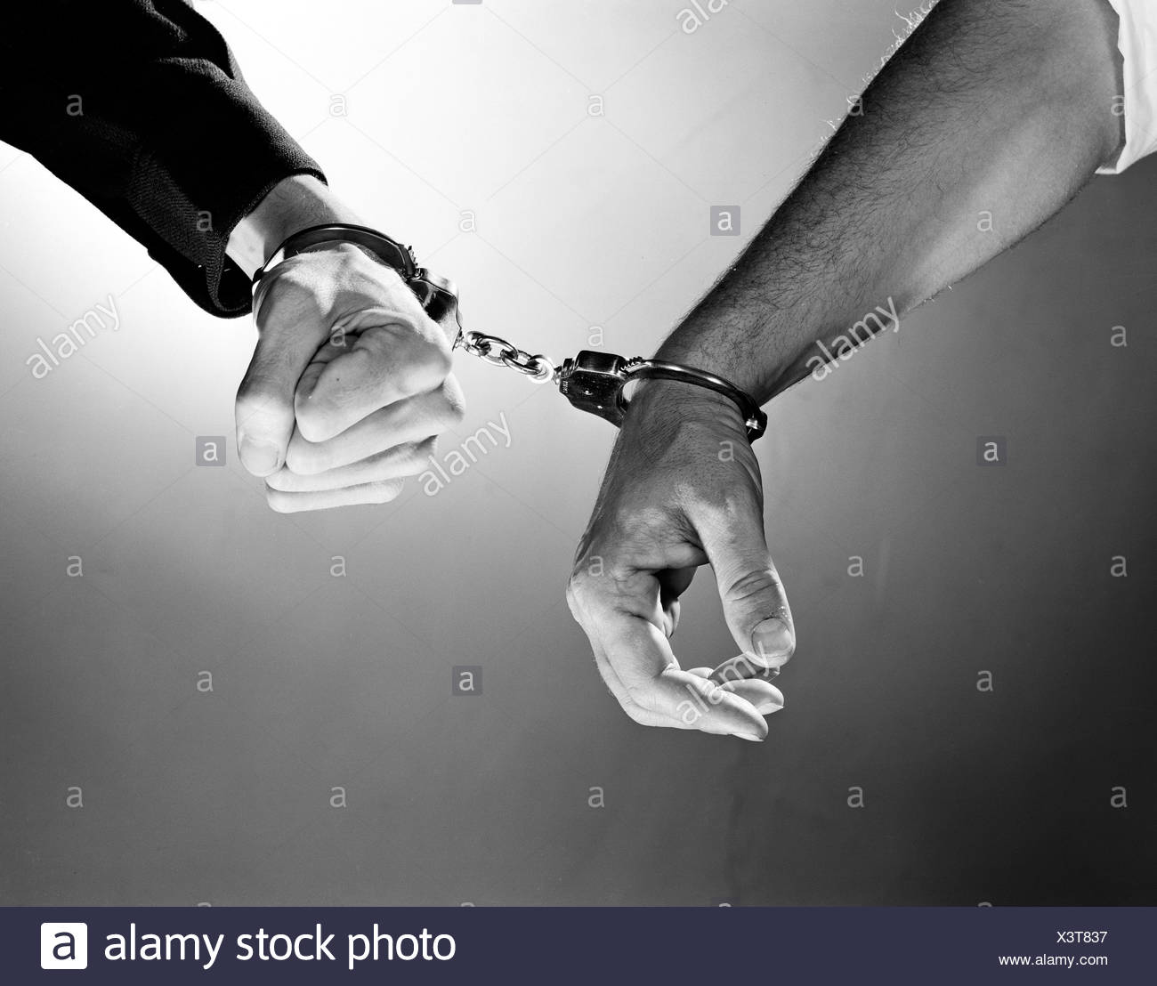 Handcuffed Black and White Stock Photos & Images - Alamy