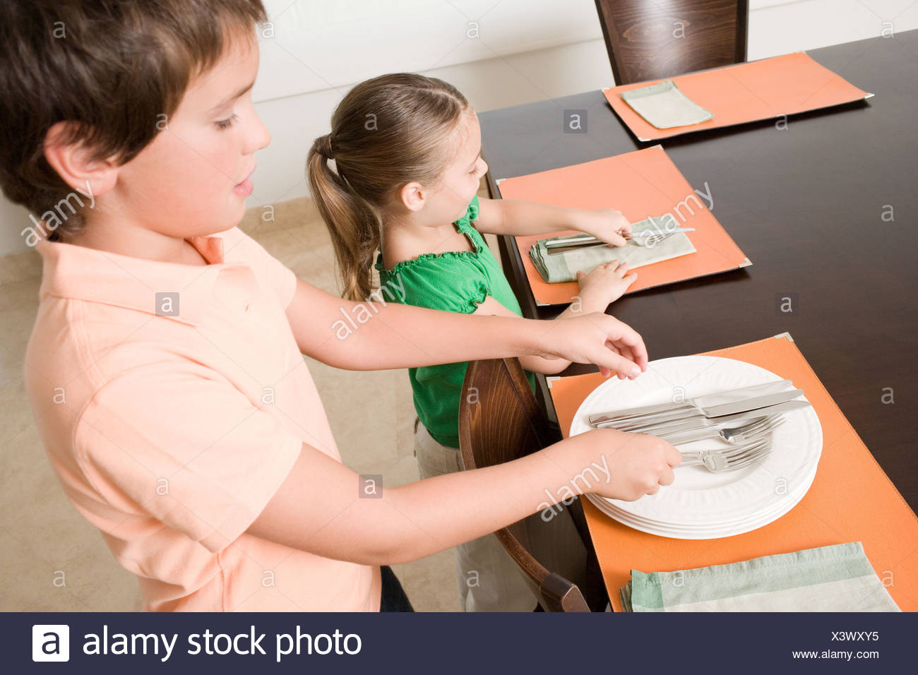Family Setting Table Dinner High Resolution Stock Photography and ...