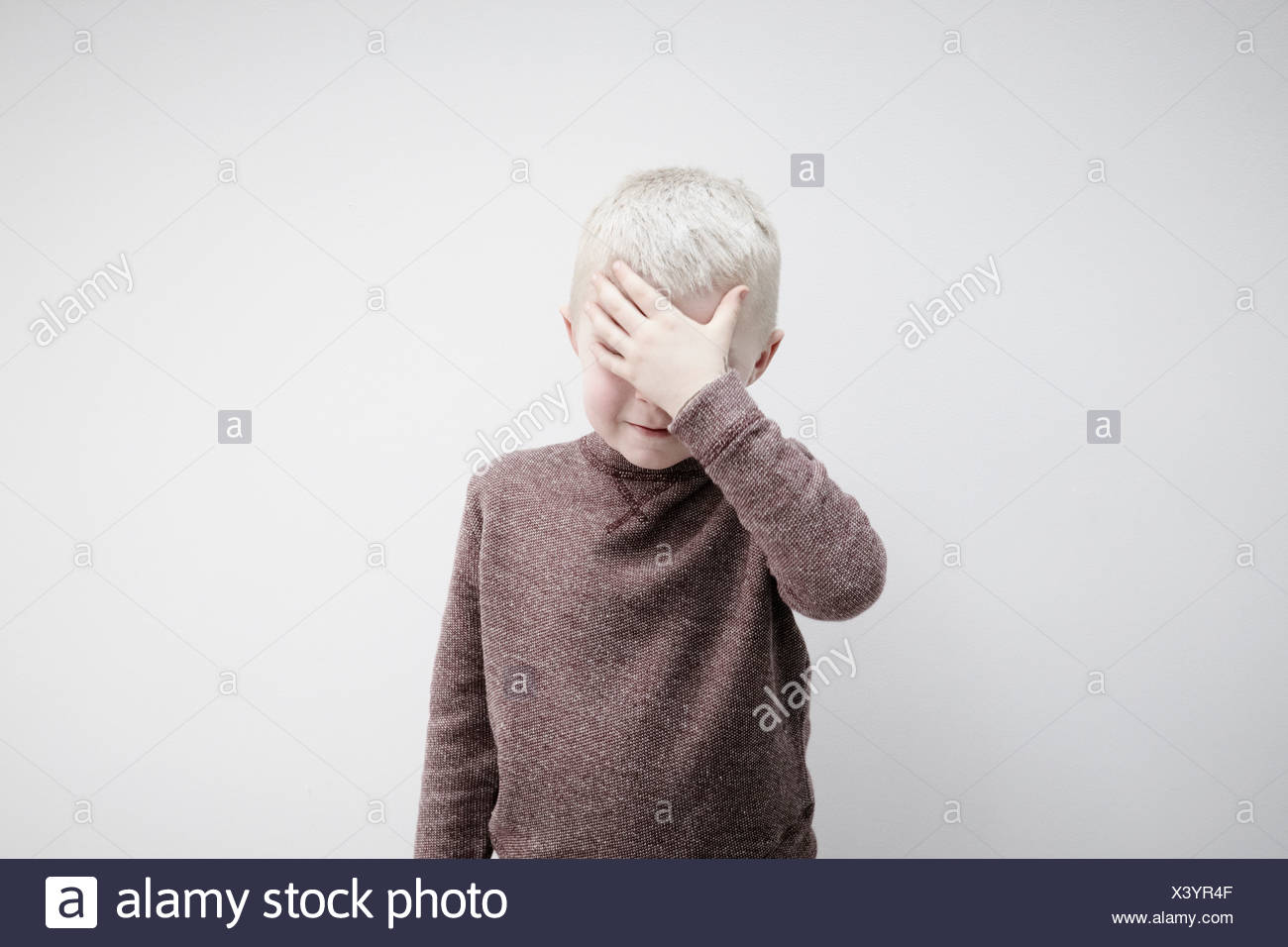 Boy Covers Face High Resolution Stock Photography and Images - Alamy