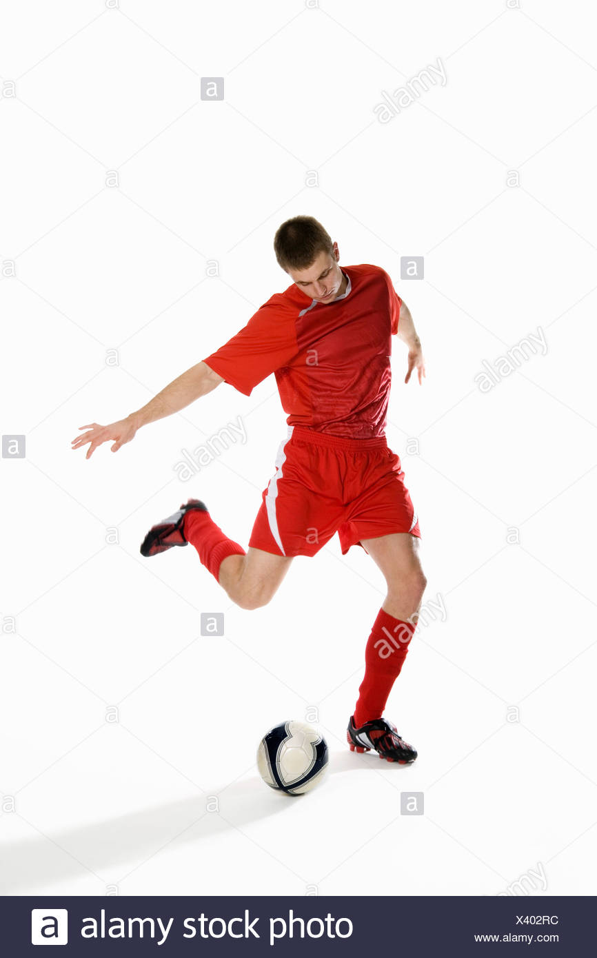 Footballer Kicking Ball Stock Photos & Footballer Kicking Ball Stock ...