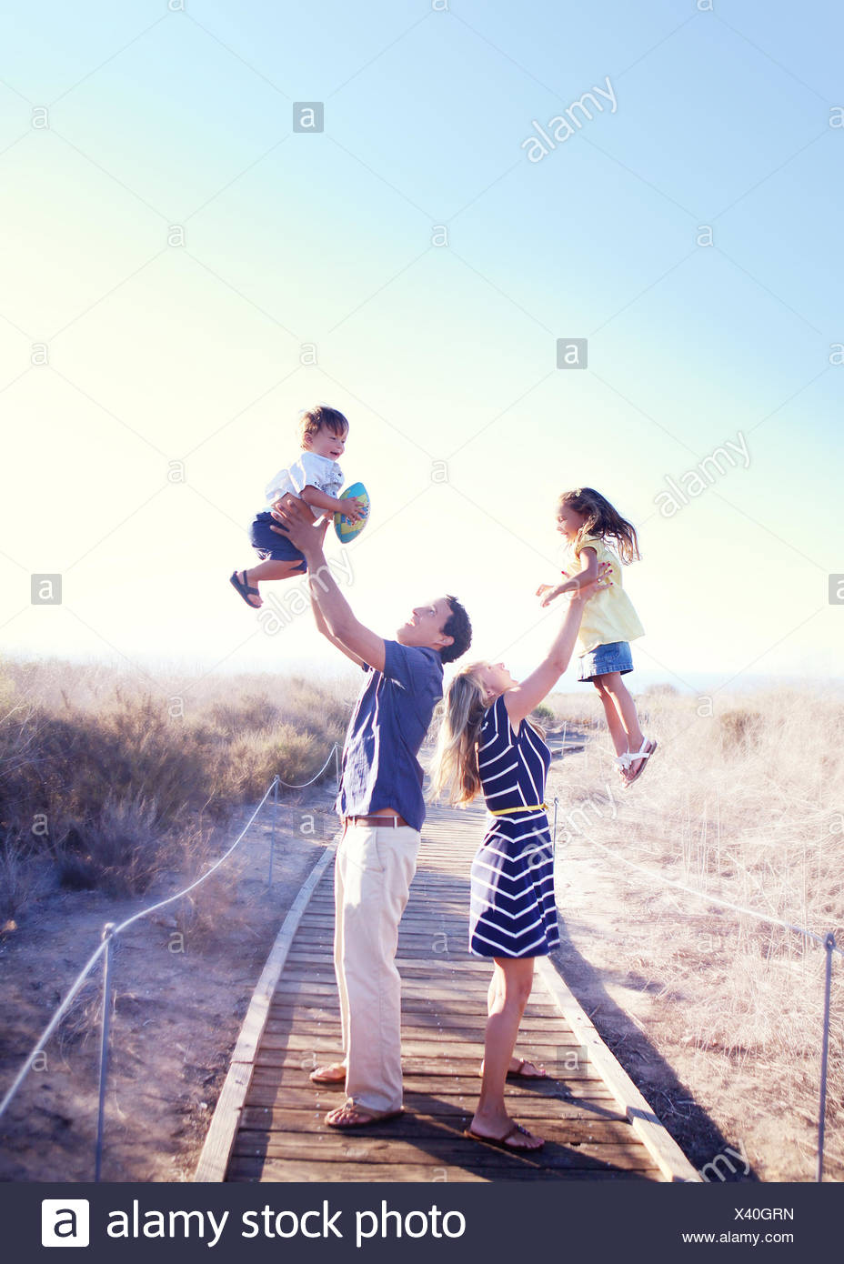 Parents Holding Their Children High Resolution Stock Photography and ...