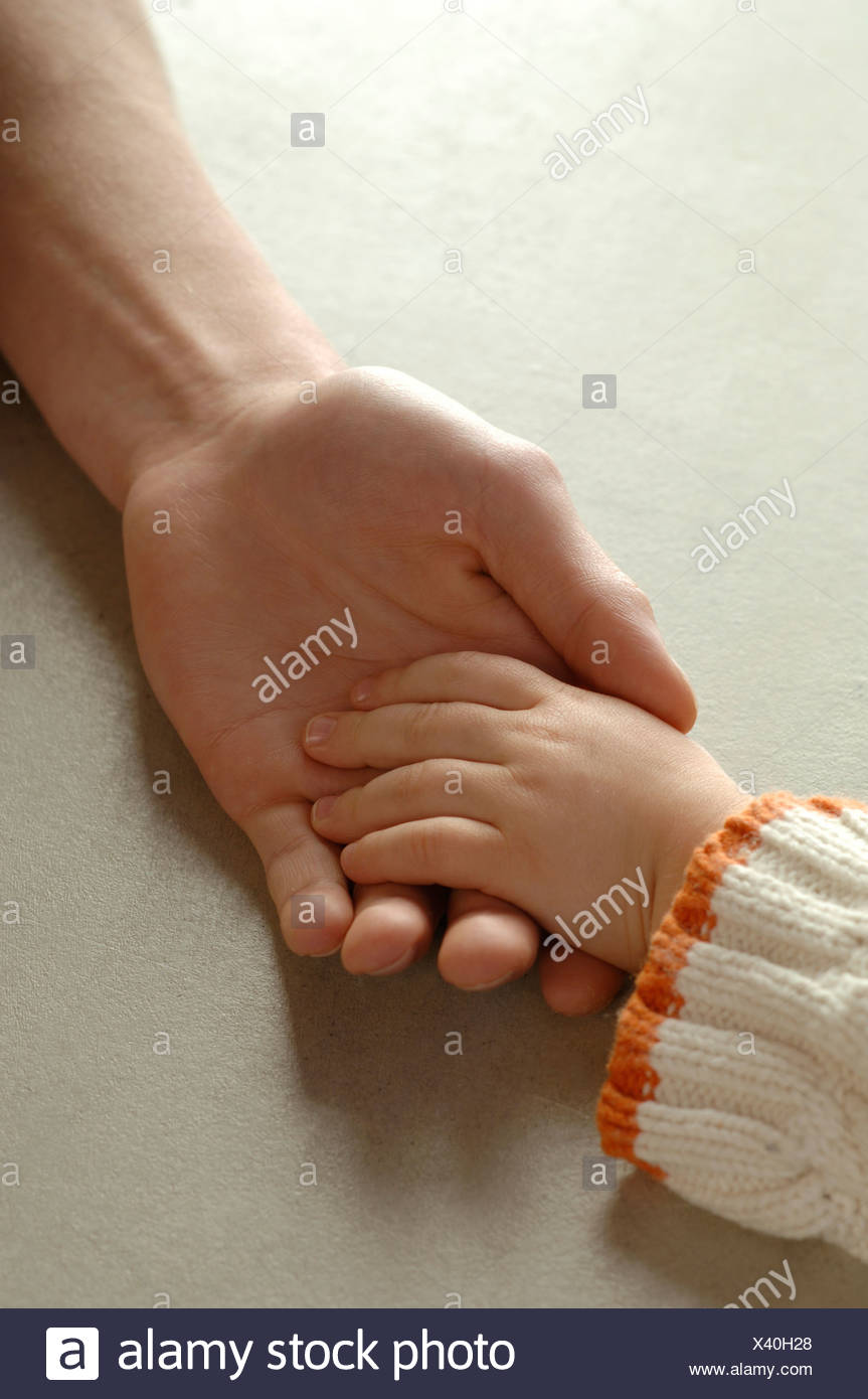Two Parents Holding Childs Hand High Resolution Stock Photography and ...