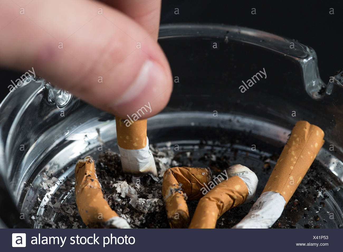 Stubbing Out A Cigarette Stock Photos & Stubbing Out A Cigarette Stock ...