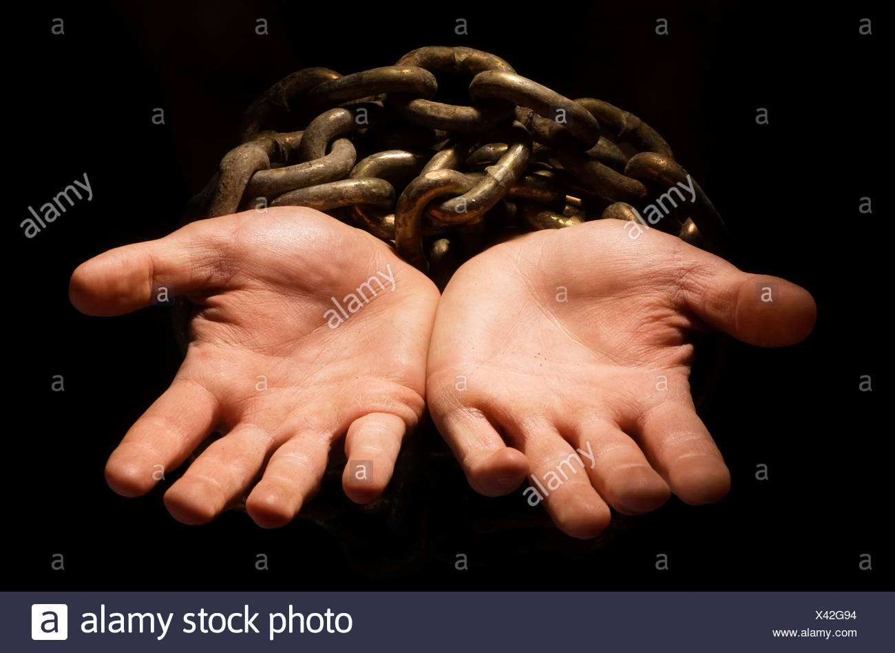 Hands Tied Chains High Resolution Stock Photography and Images - Alamy