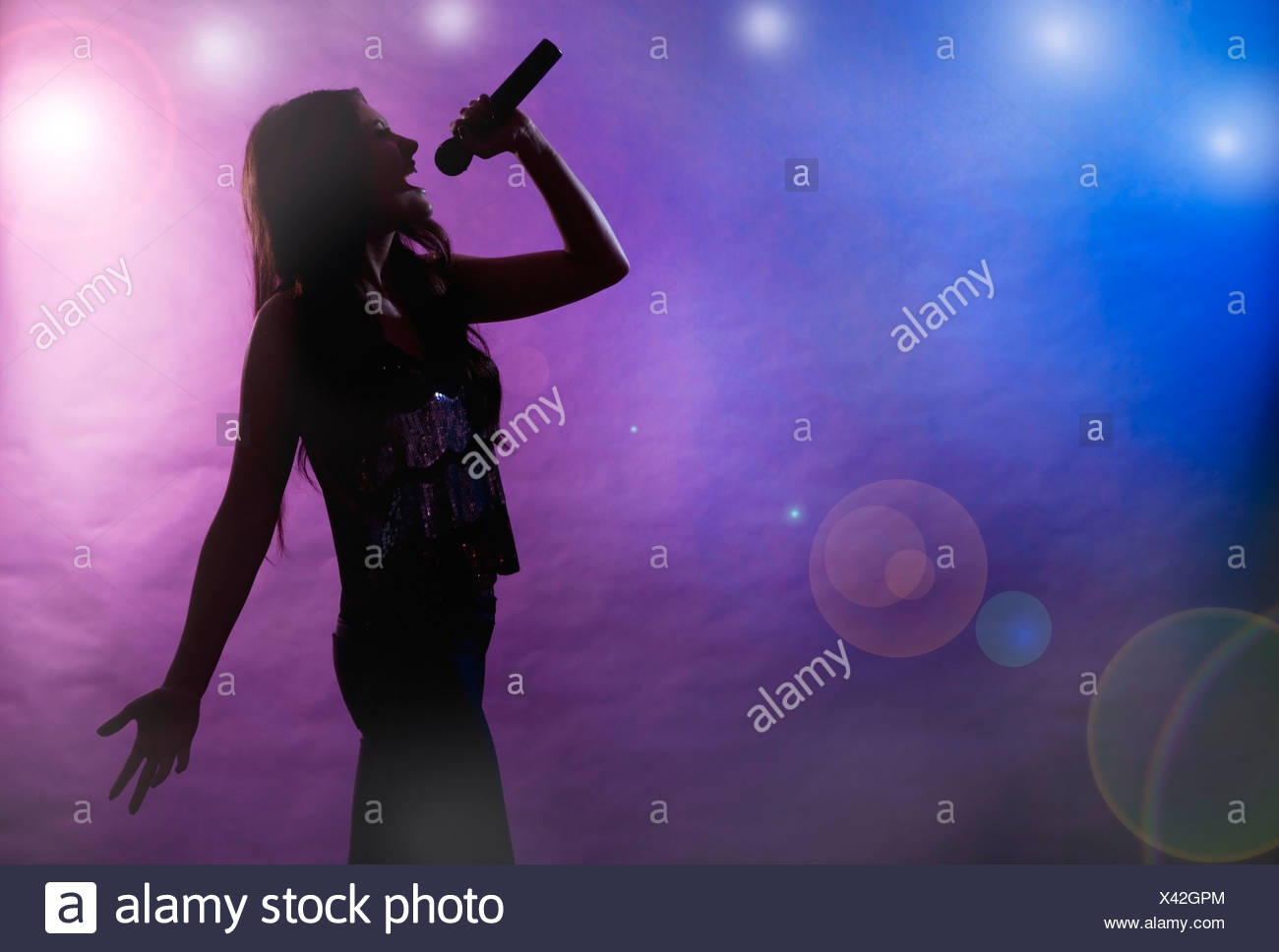 Silhouette Of Female Singer On Stage High Resolution Stock Photography ...
