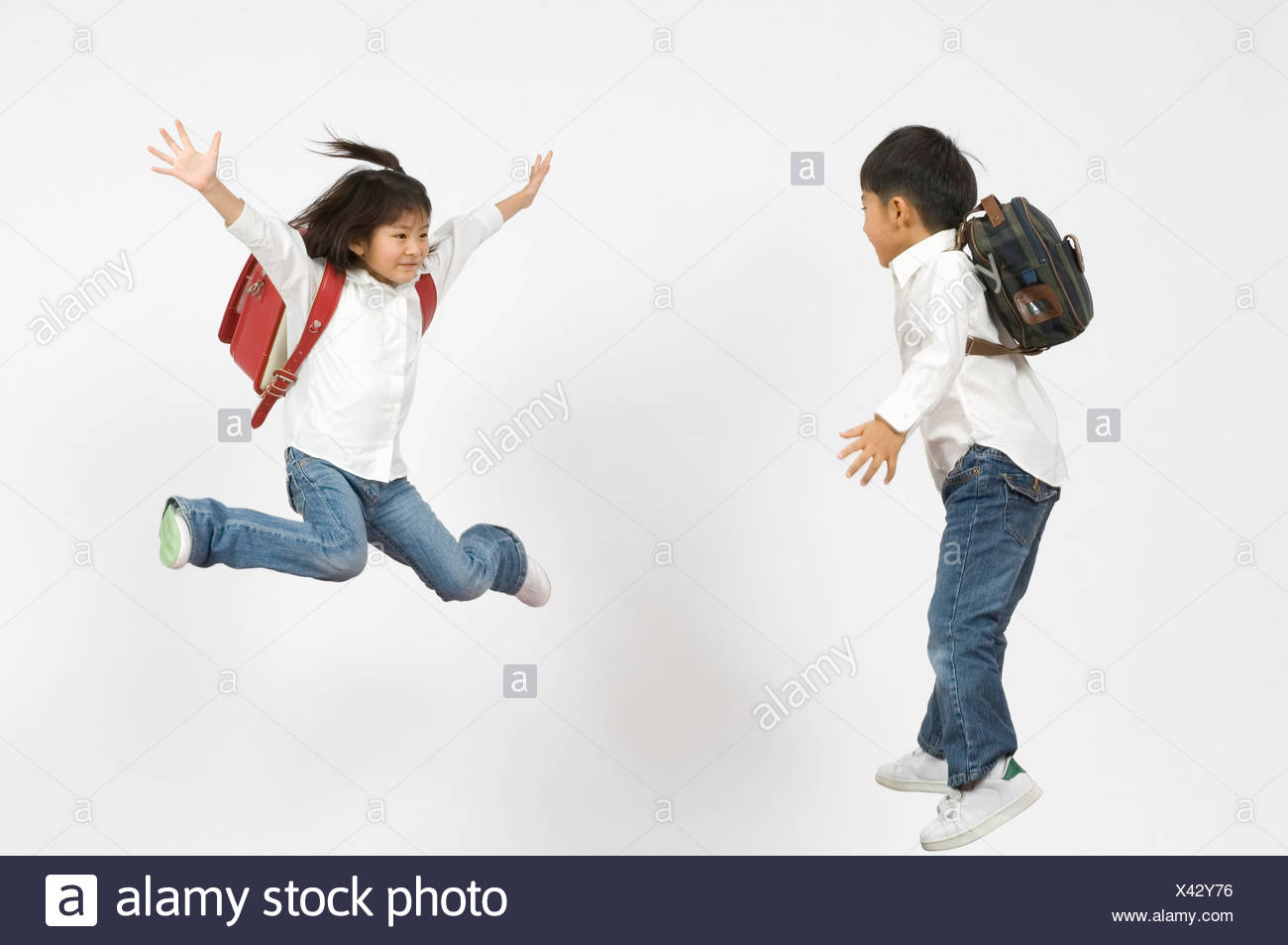 School Students Jumping Stock Photos & School Students Jumping Stock ...