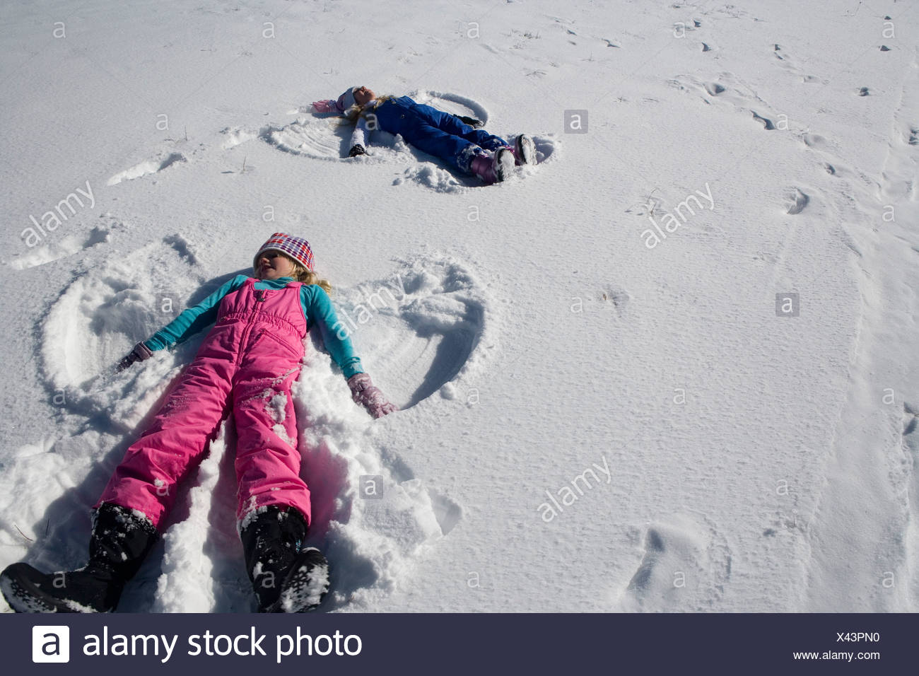 Children Making Snow Angels High Resolution Stock Photography and ...
