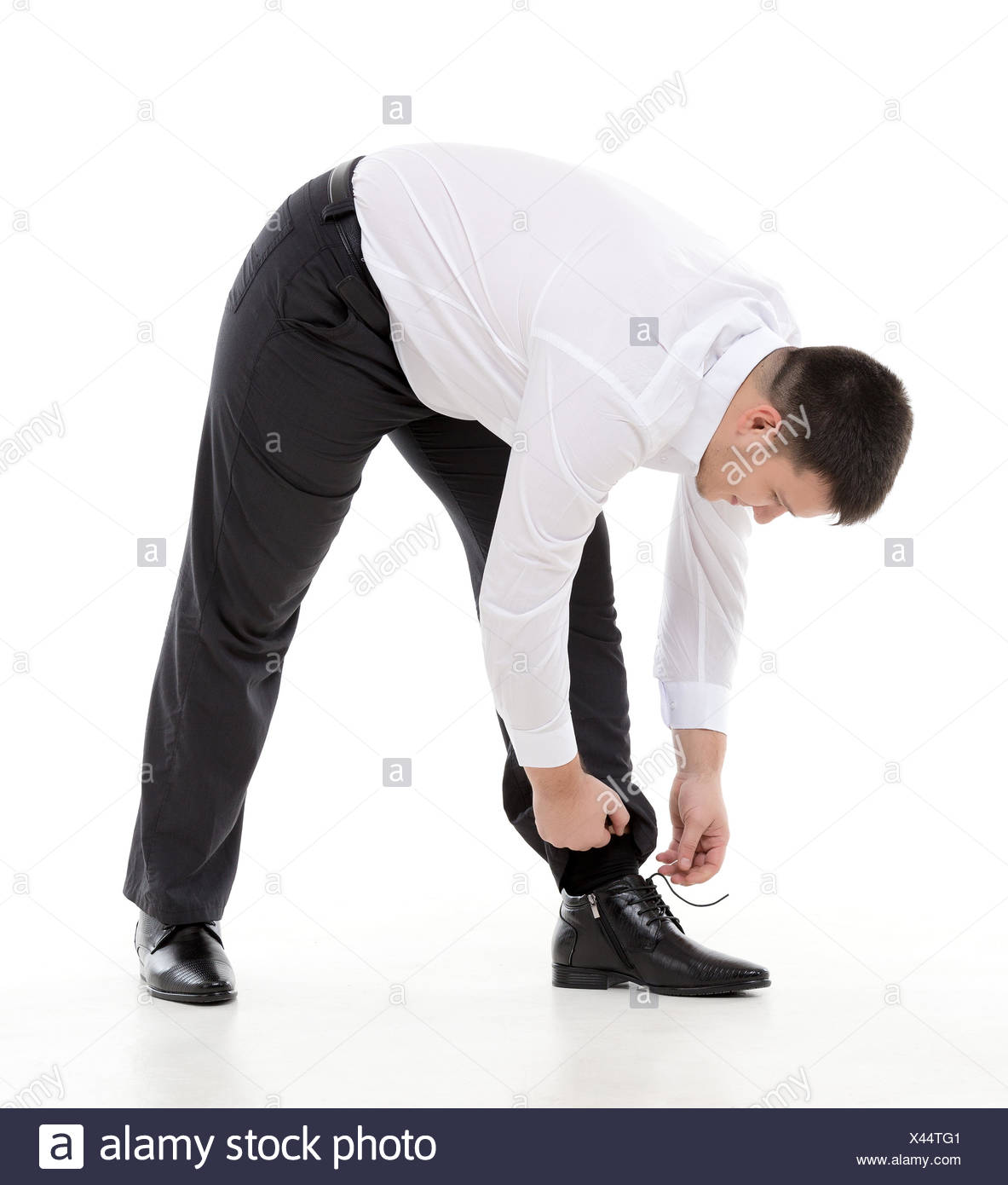Man Bending Down High Resolution Stock Photography and Images - Alamy
