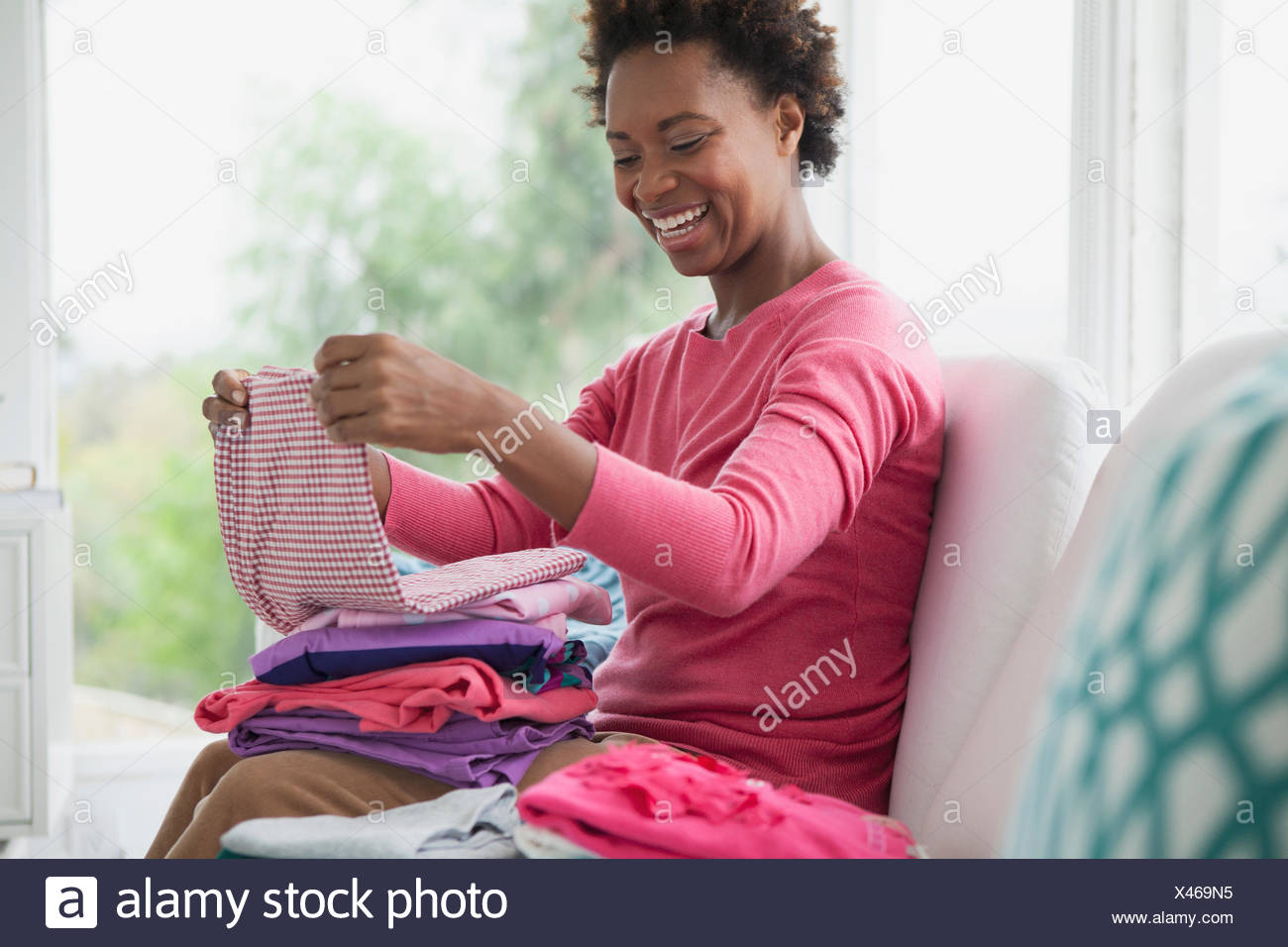 Woman Folding Laundry Folding Clothes Stock Photos & Woman Folding ...