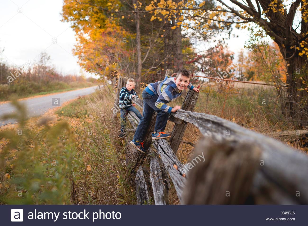 Climbing Over Fence High Resolution Stock Photography and Images - Alamy