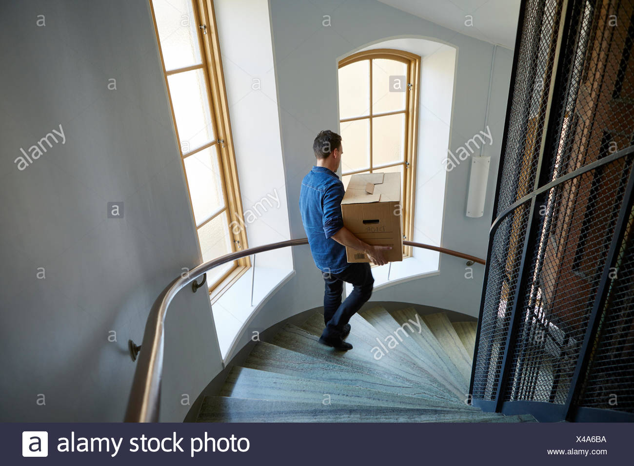 Man Walking Down Staircase High Resolution Stock Photography and Images ...