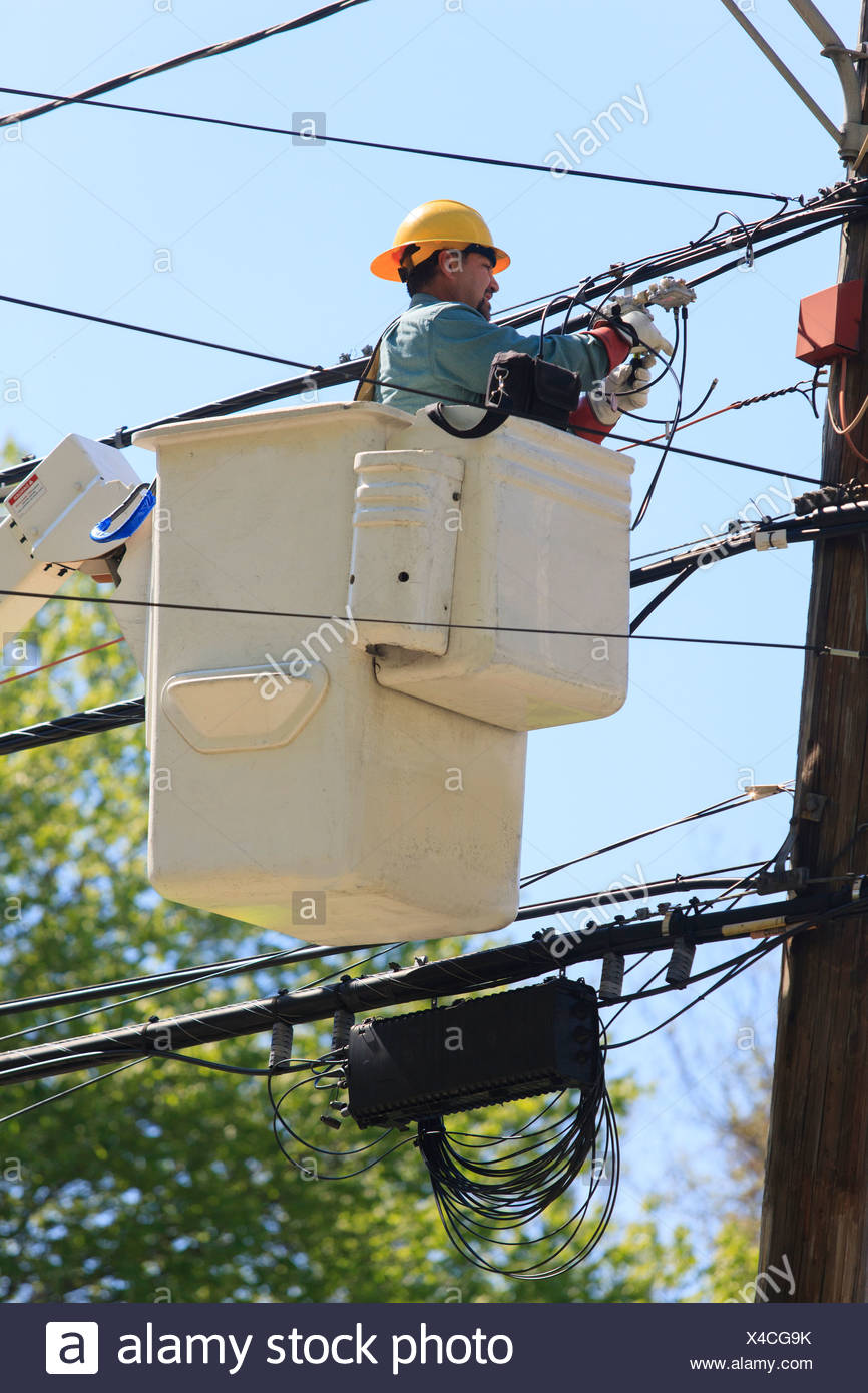 Man Working On High Voltage Power Lines High Resolution Stock ...