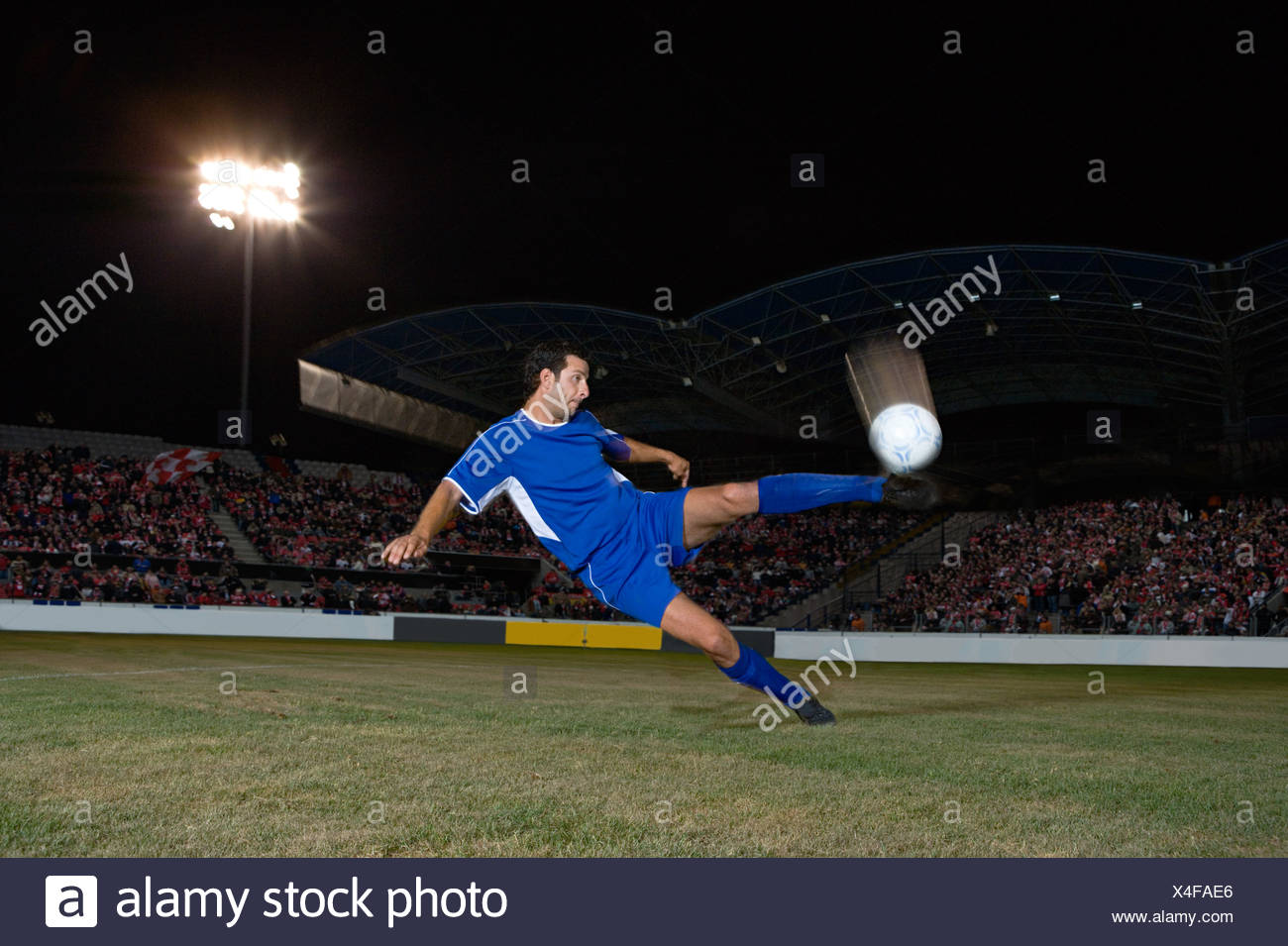 Footballer Kicking Ball Stock Photos & Footballer Kicking Ball Stock ...