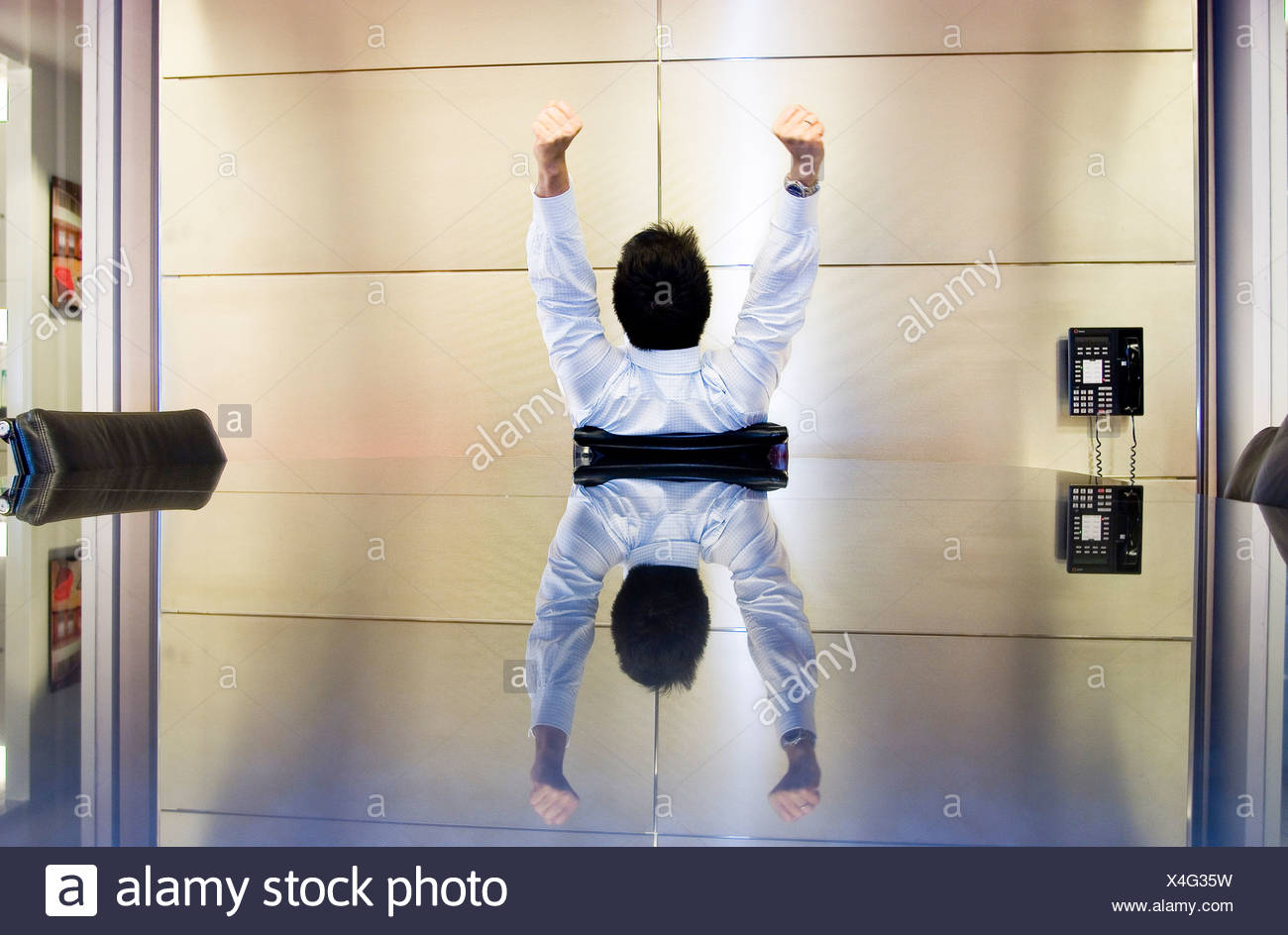 Businessman Leaning Over Office Chair High Resolution Stock Photography ...