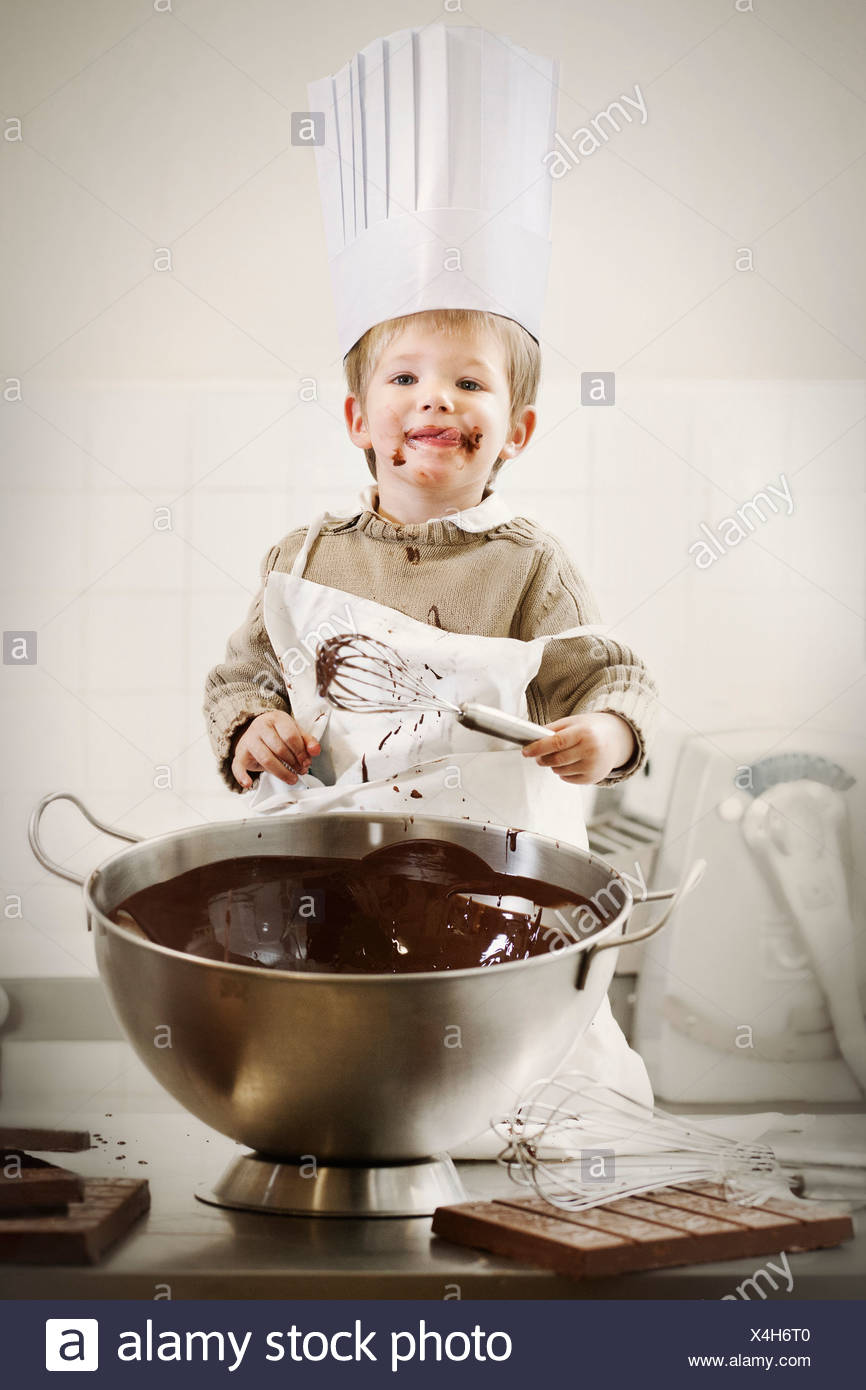 Boy Mixing Chocolate In Kitchen High Resolution Stock Photography and ...