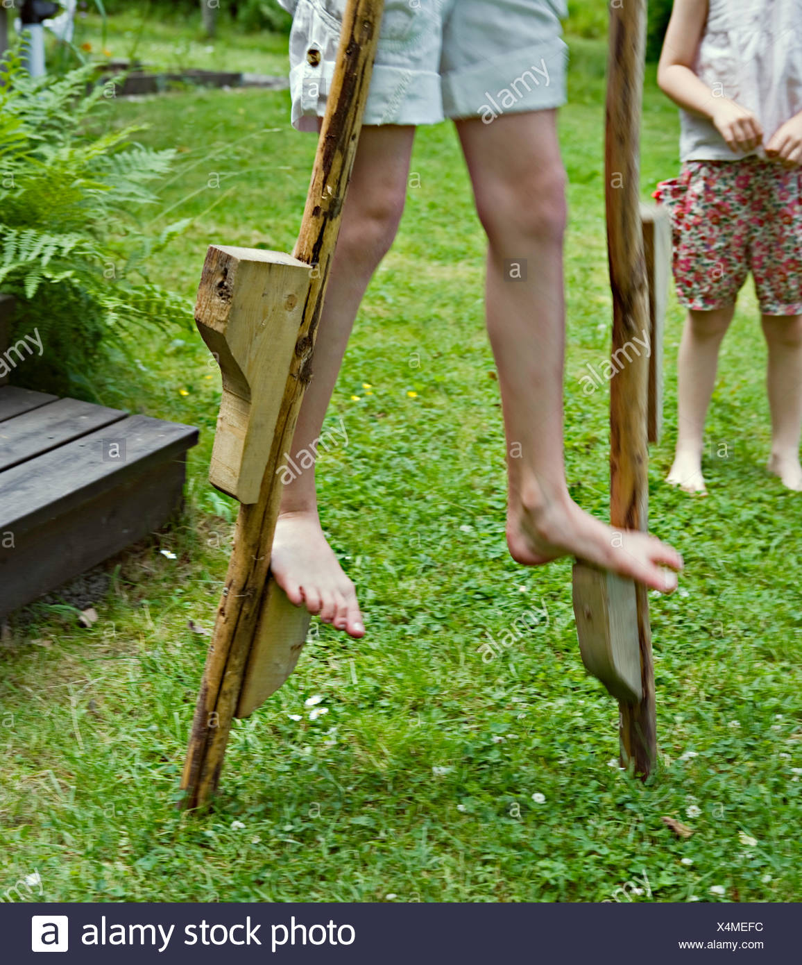 Girl On Stilts Stock Photos & Girl On Stilts Stock Images - Alamy